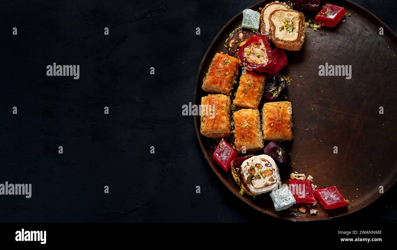 Ramadan food on a large plate. Arabic sweets - lokum, fruit marmalade ...