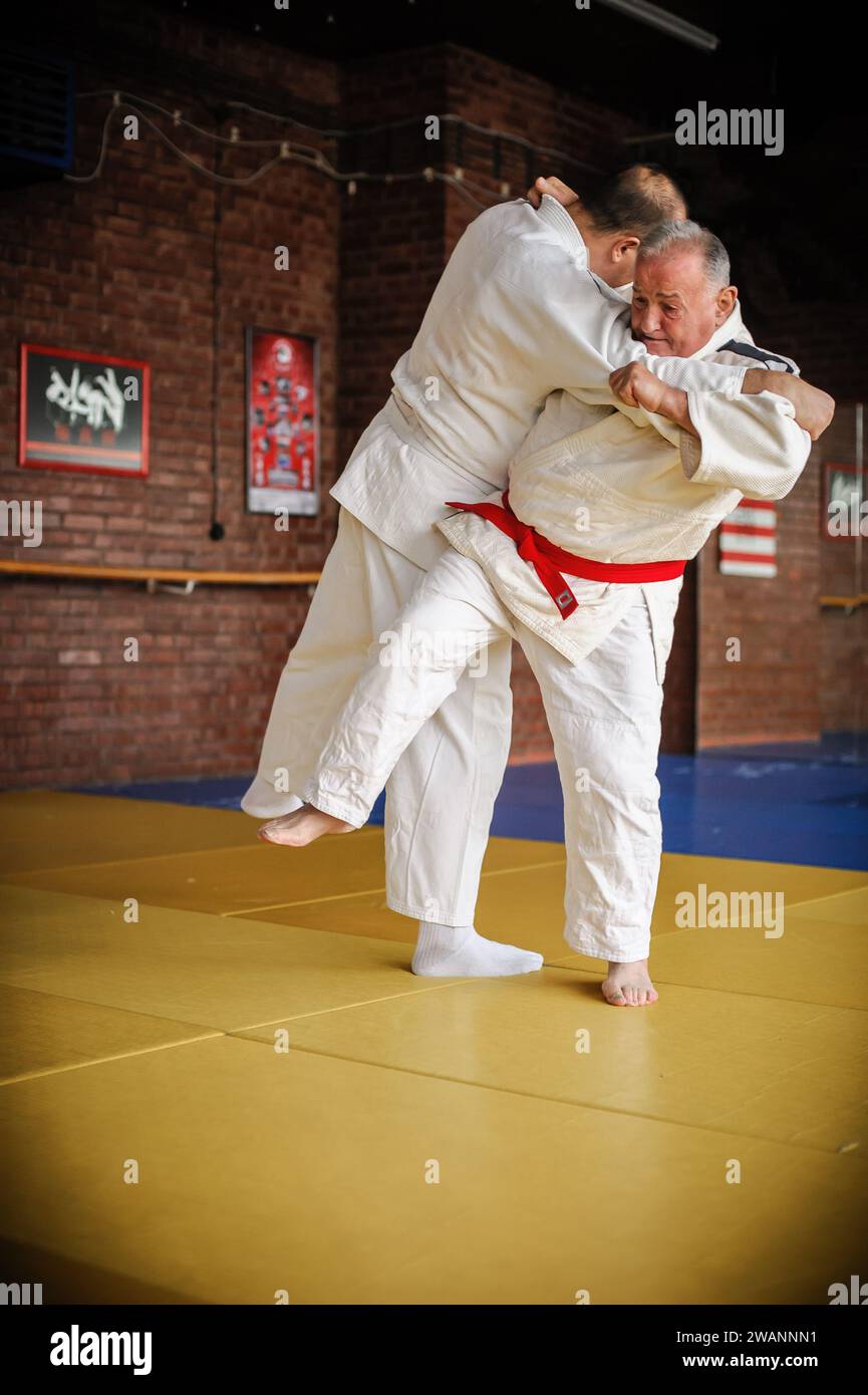 Judo sensei master instructor in traditional gi kimono demonstrate judo ...