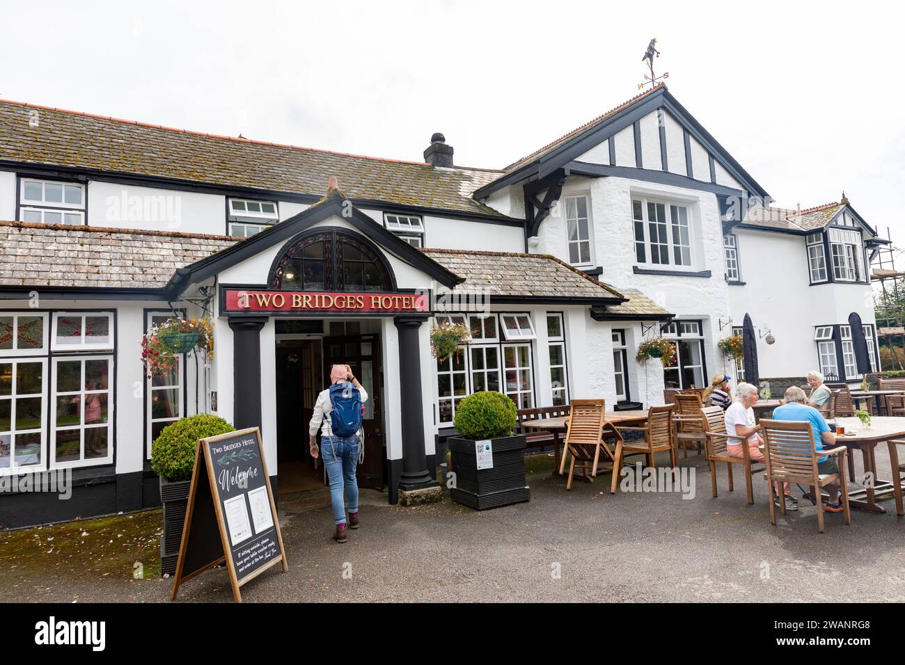 Two Bridges hotel Dartmoor national park, Devon, female hiker walks ...