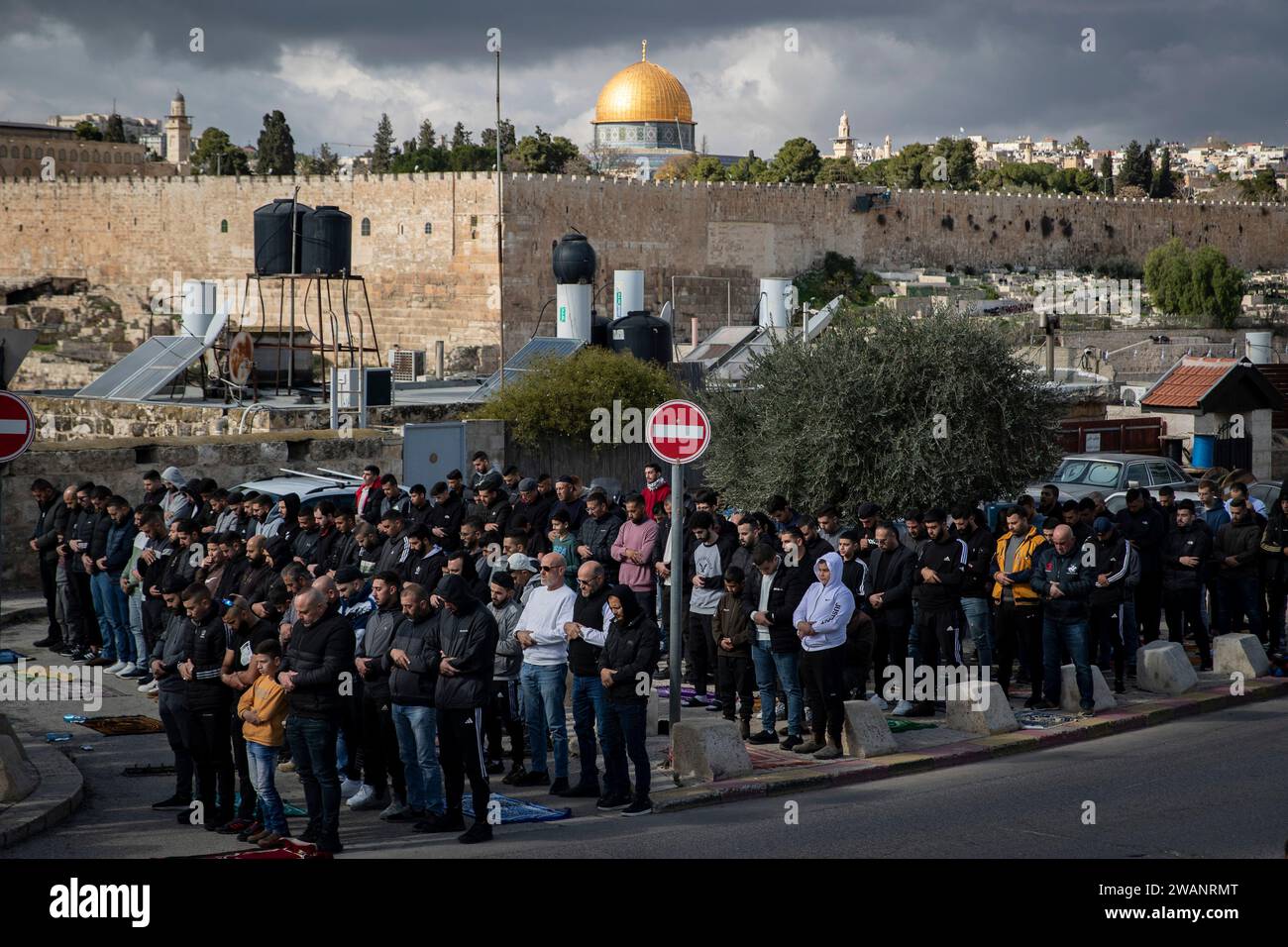 Jerusalem. 5th Jan, 2024. People pray near the Old City of Jerusalem ...