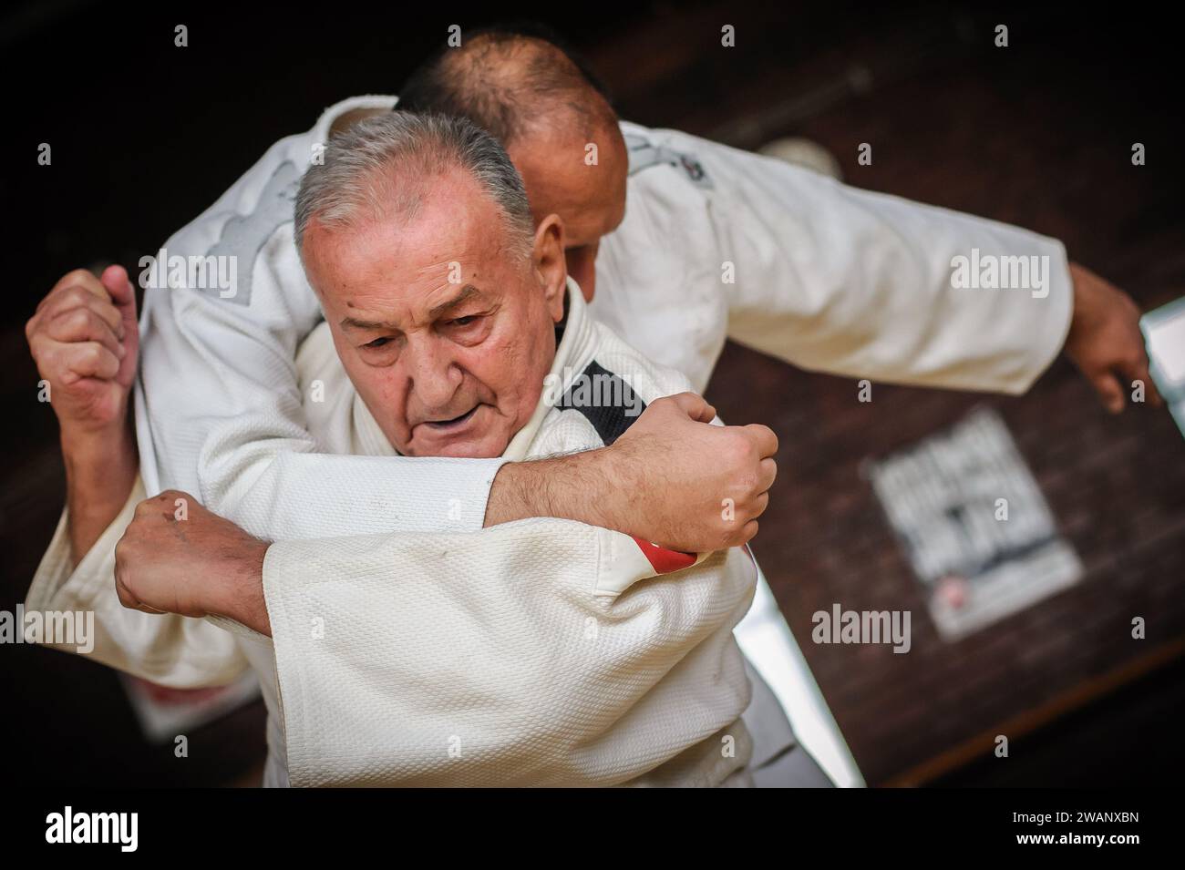 Close-up portrait of judo sensei master instructor in traditional gi ...