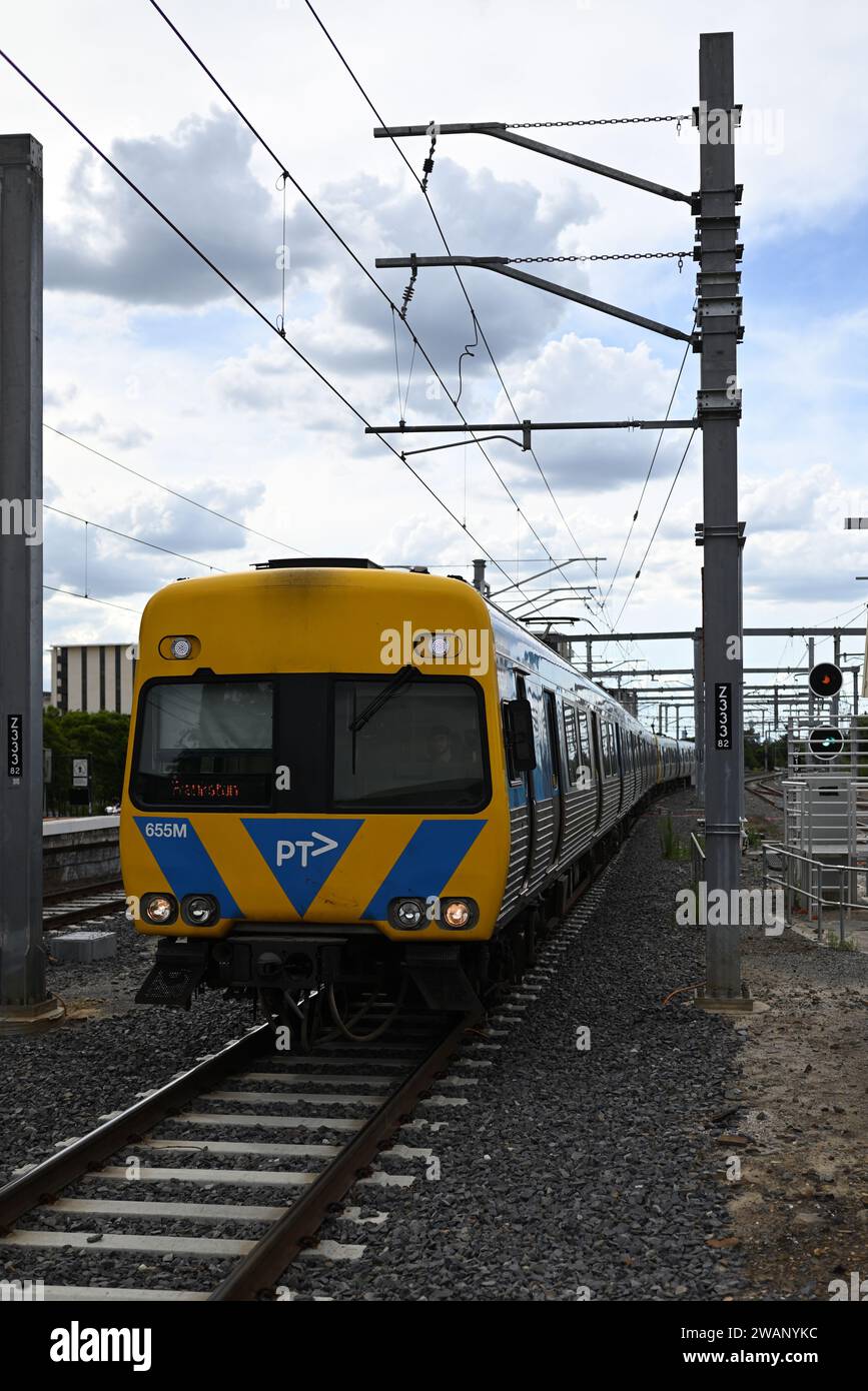 Front view of a Comeng train, featuring blue and yellow PTV livery, on ...
