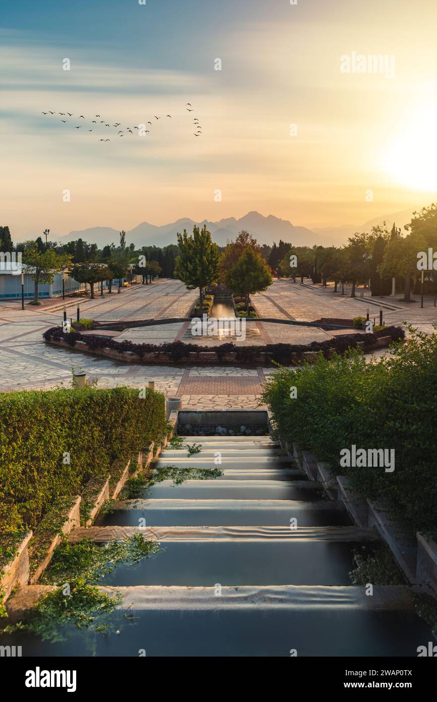 Sunset view of the walking path and ornamental pools in front of ...