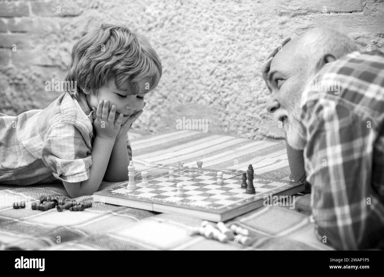 Chess piece. Grandfather and grandson concept. Handsome grandpa and ...