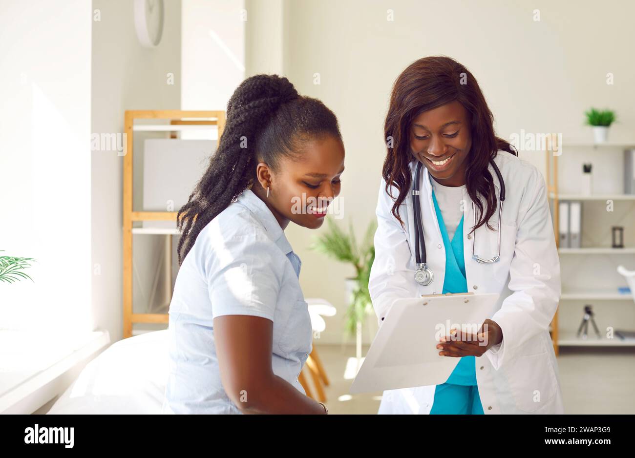 Young African American woman is ready to sign health insurance contract ...