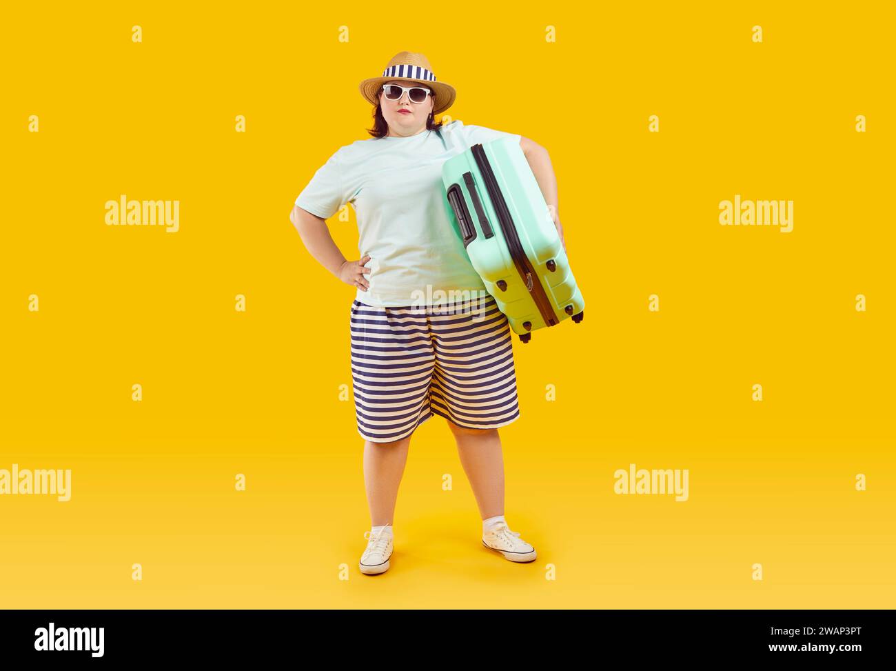 Overweight woman tourist in summer wear going on holiday and carrying ...