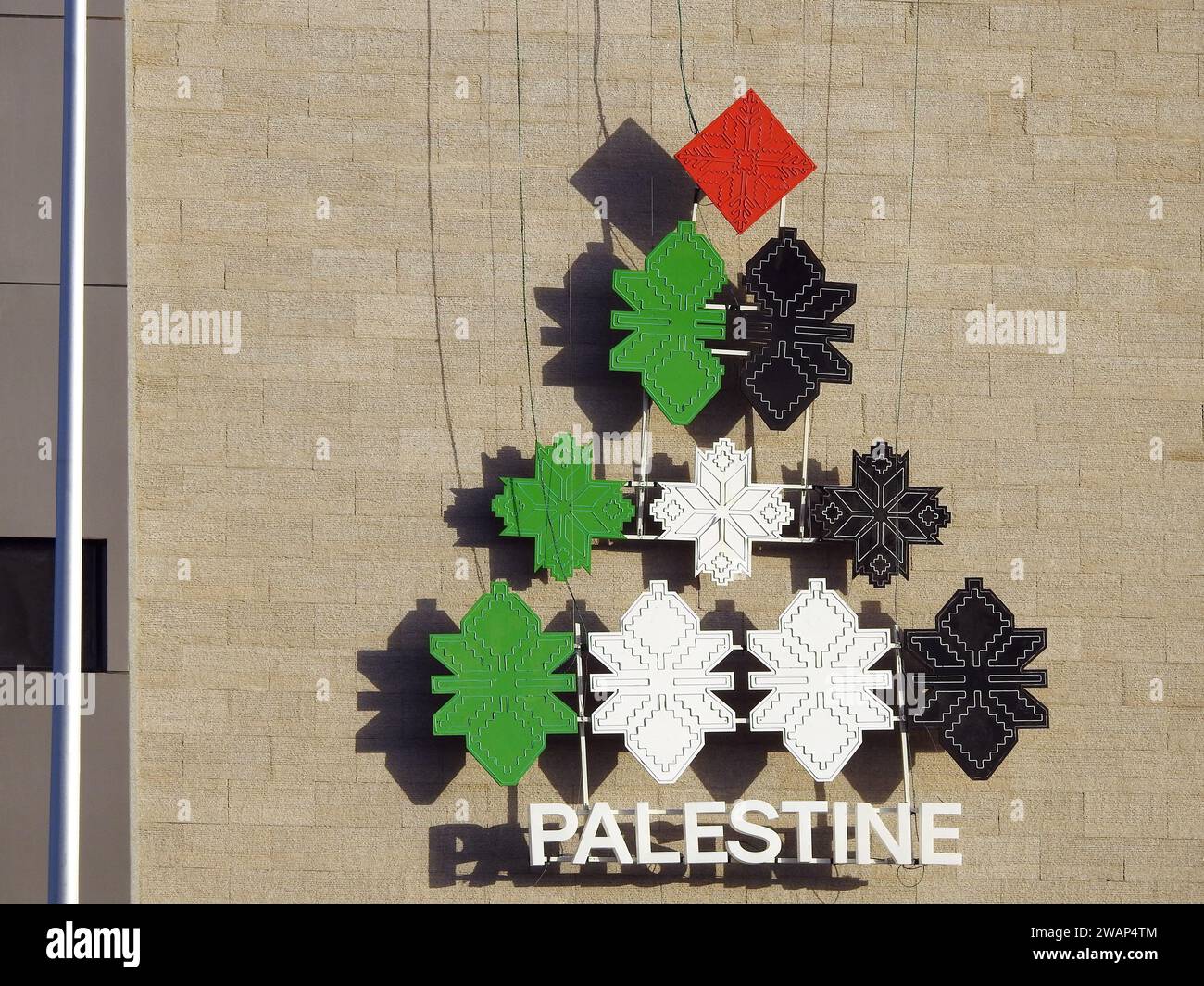 A pyramidal shape with the colors of the Palestinian flag, with the ...