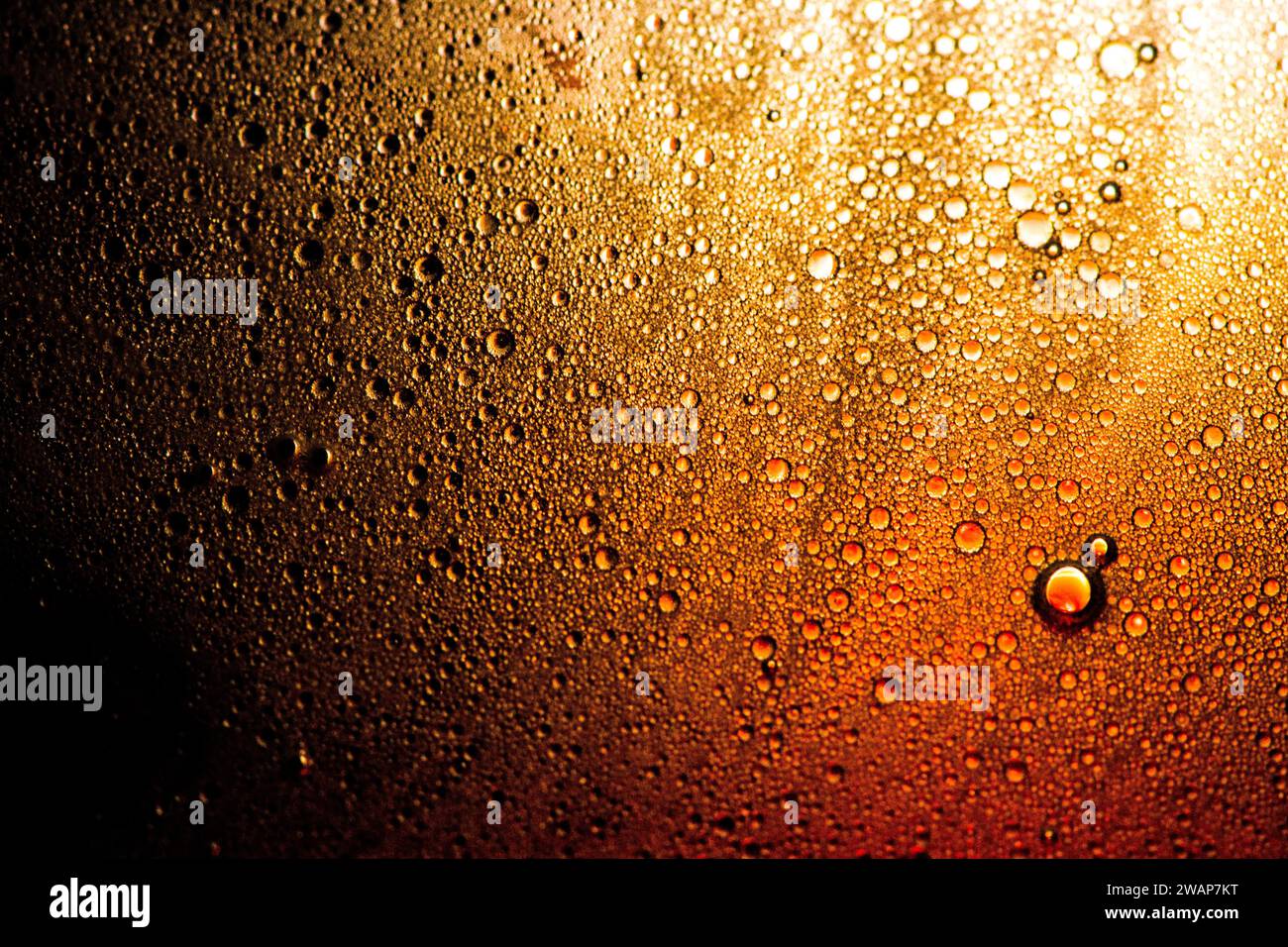 Bubbles created using soap and water mixed in cooking oil with back ...