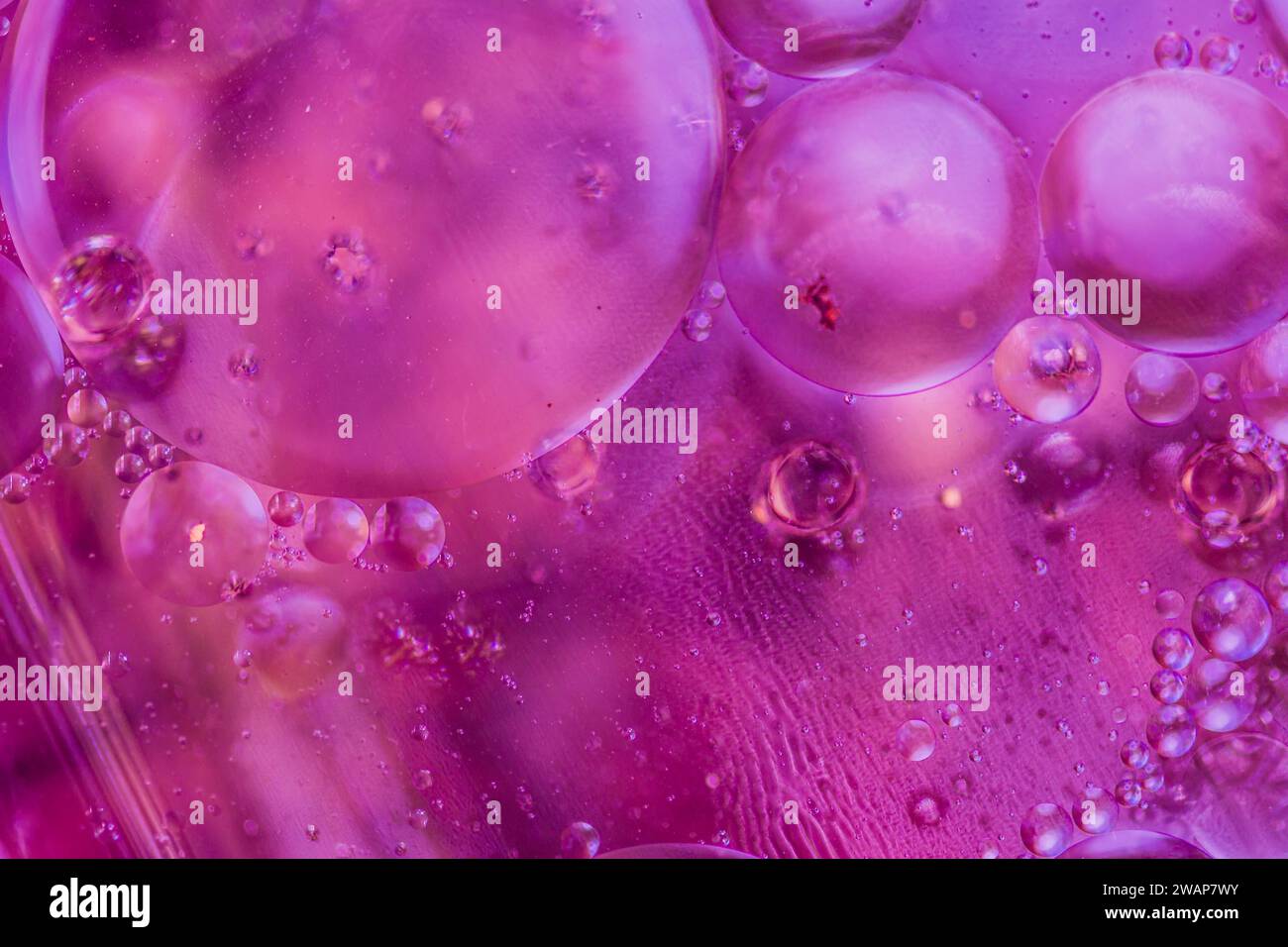 Abstract oil in water using natural light in maroon tones. Good for ...