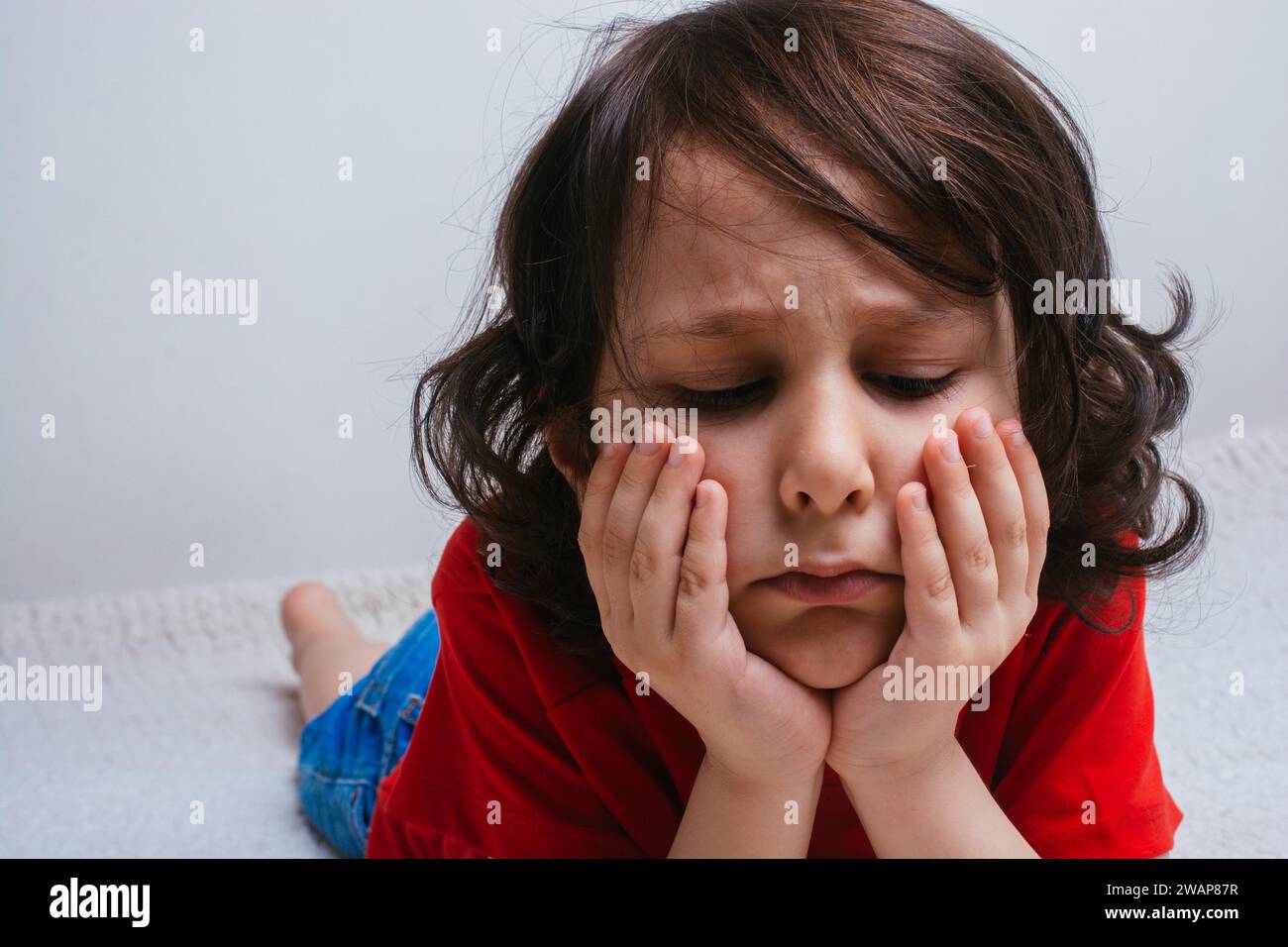 Emotional intelligence and depressed boy looking lonely Stock Photo - Alamy