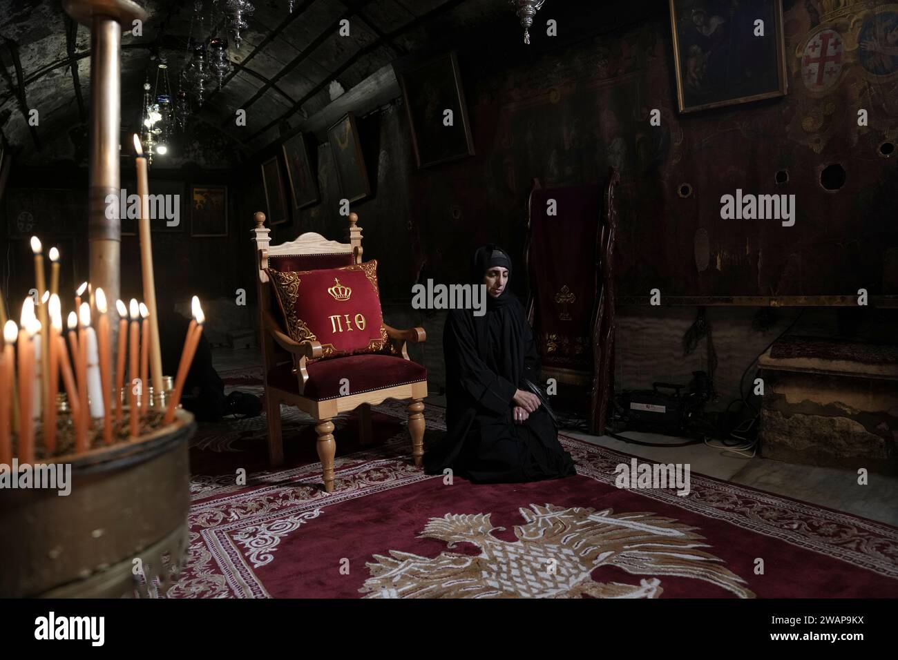 A nun visits the Grotto of the Nativity Church, where Christians ...