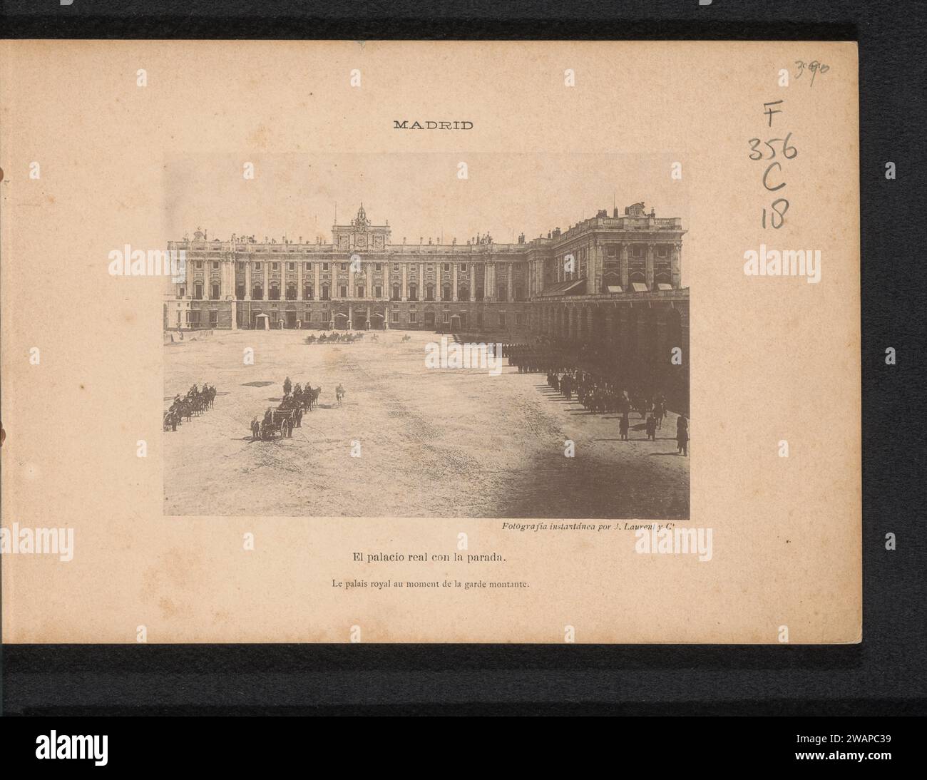 View of the Royal Palace of Madrid with a parade of the whisk in front ...