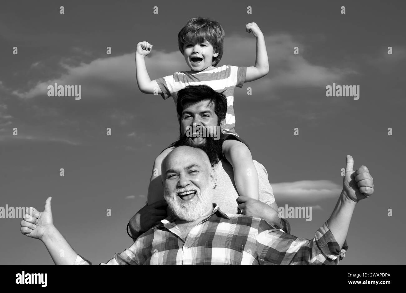 Fathers day concept. Happy three generations of men have fun and ...