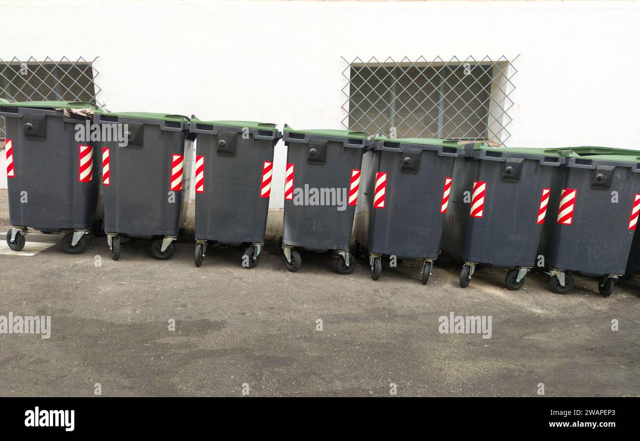 Line of grey dumpsters on sideway hi-res stock photography and images ...