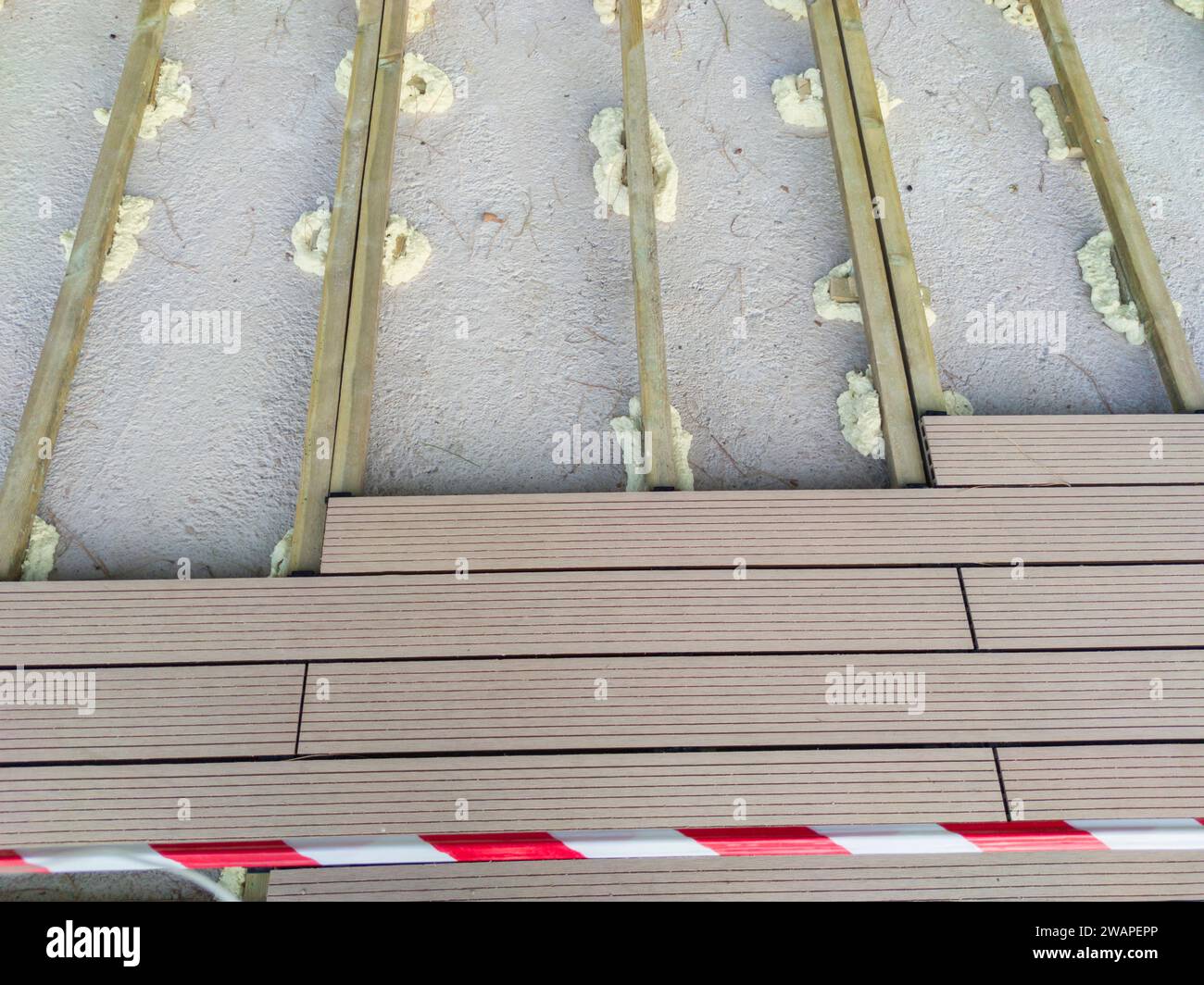 Installation Of Wooden Flooring On A Polyurethane Foam Base Urban Background Close To Public
