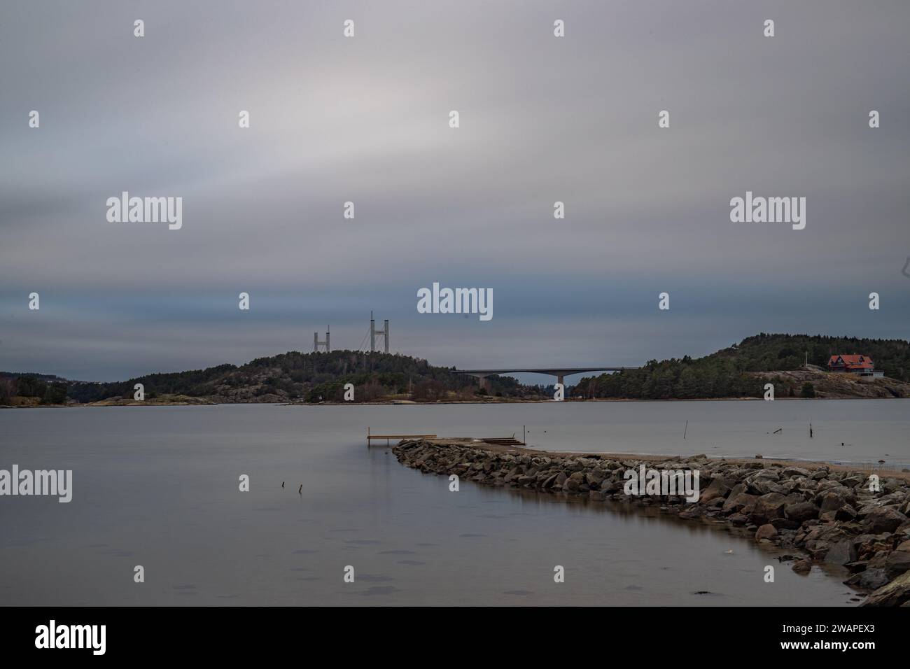 Landscape shot on a coast in winter with a view of the Tjörnbron cable ...