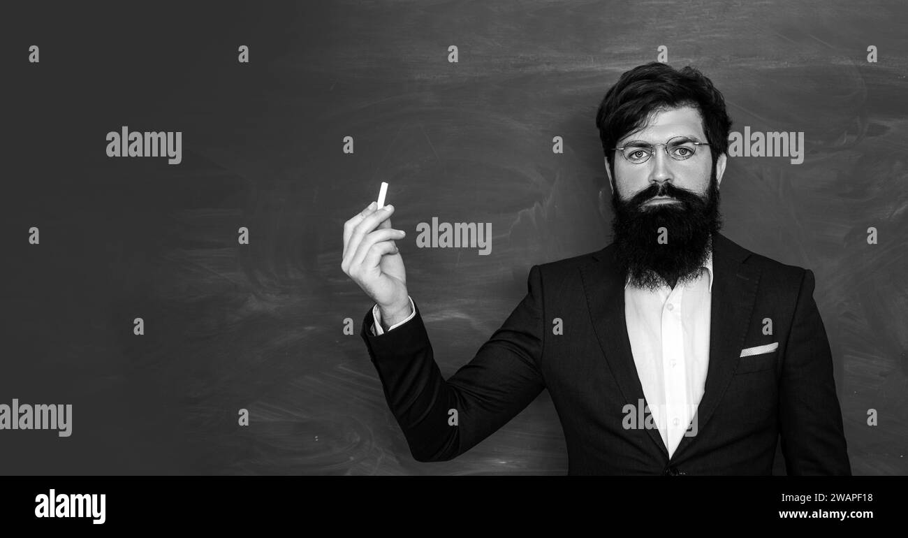 Good teachers enjoy teaching. Bearded professor at school lesson at ...