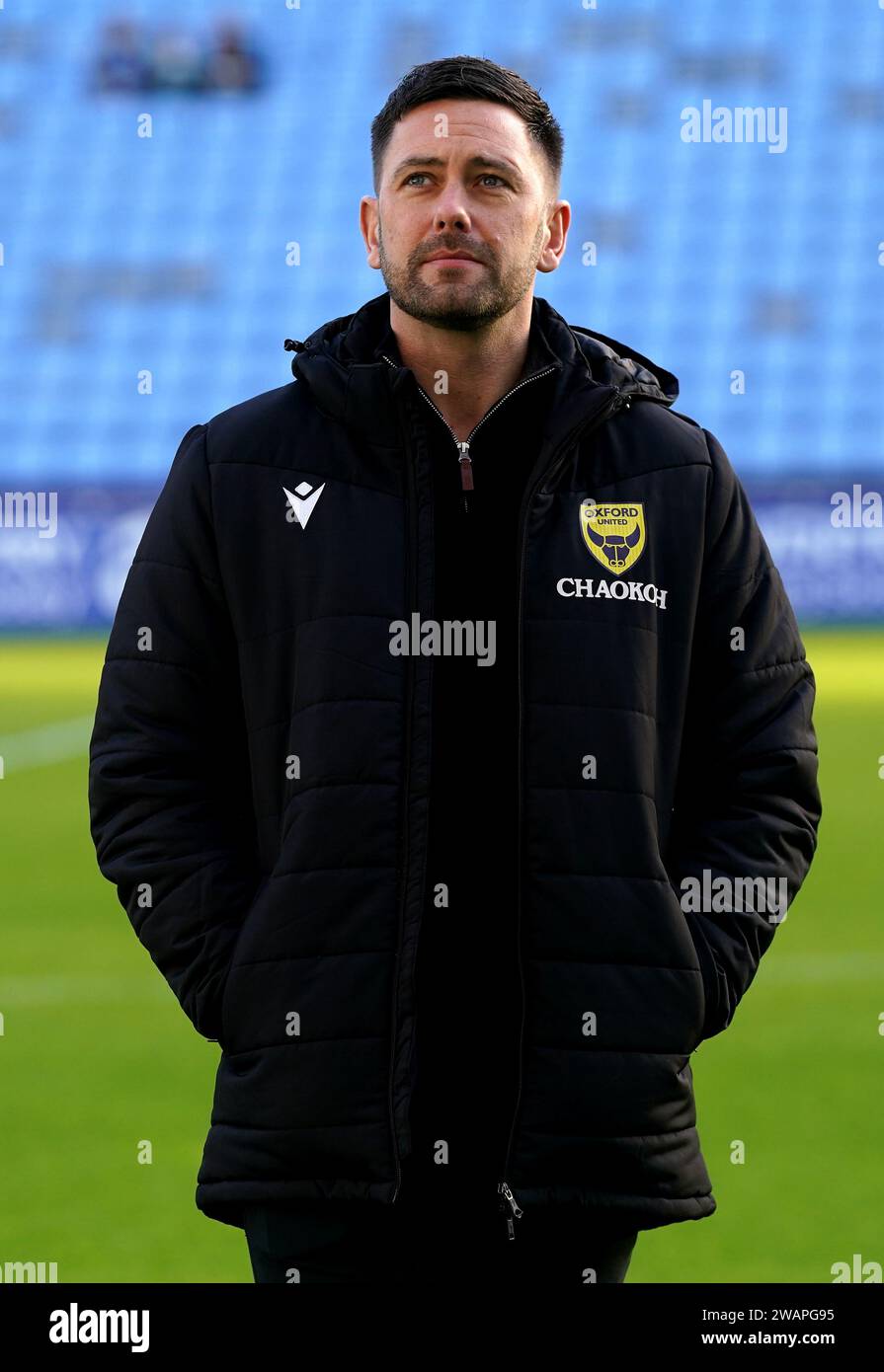 Oxford United manager Des Buckingham inspects the pitch before the ...
