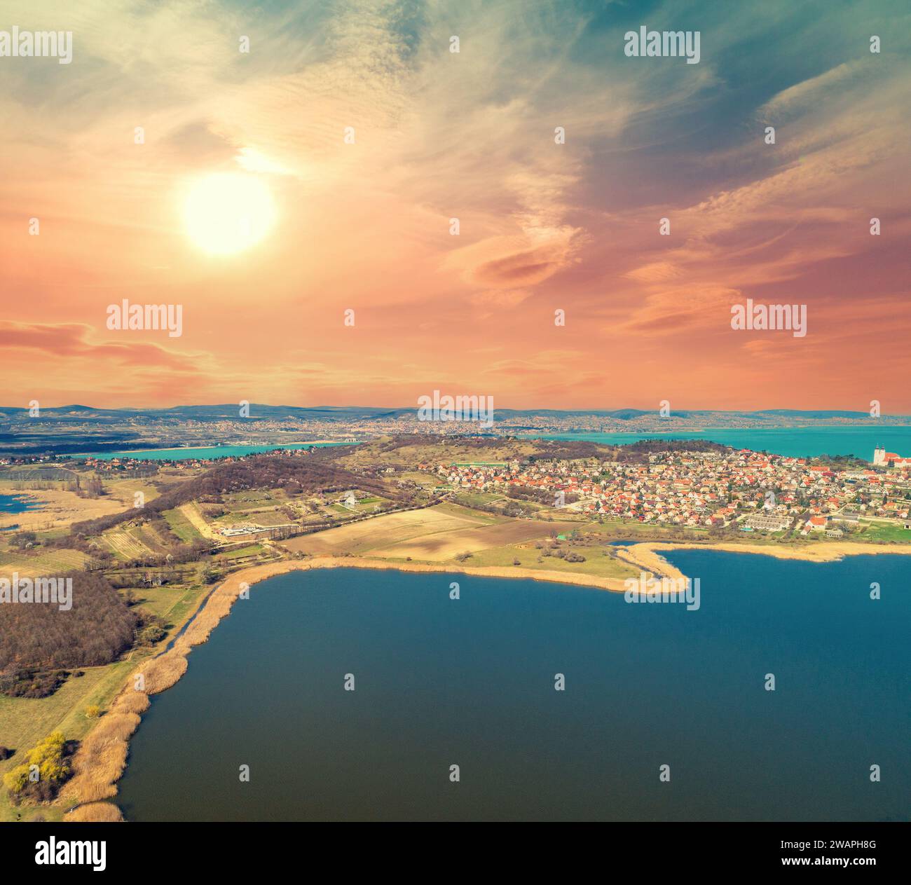 Top view of Lake Belso-to (Belső-tó) and Lake Balaton during sunset ...