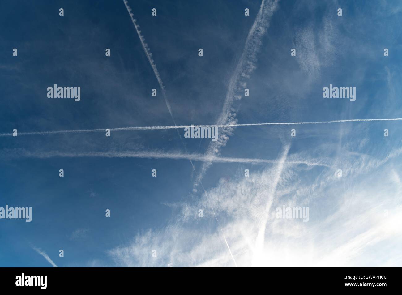 Contrails in clear winter sky Stock Photo - Alamy Contrails in clear winter sky Stock Photo - Alamy