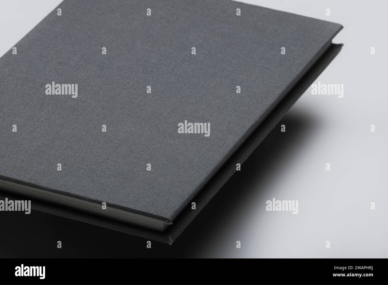 Empty grey floating book mockup. Studio shot of a blank closed book ...