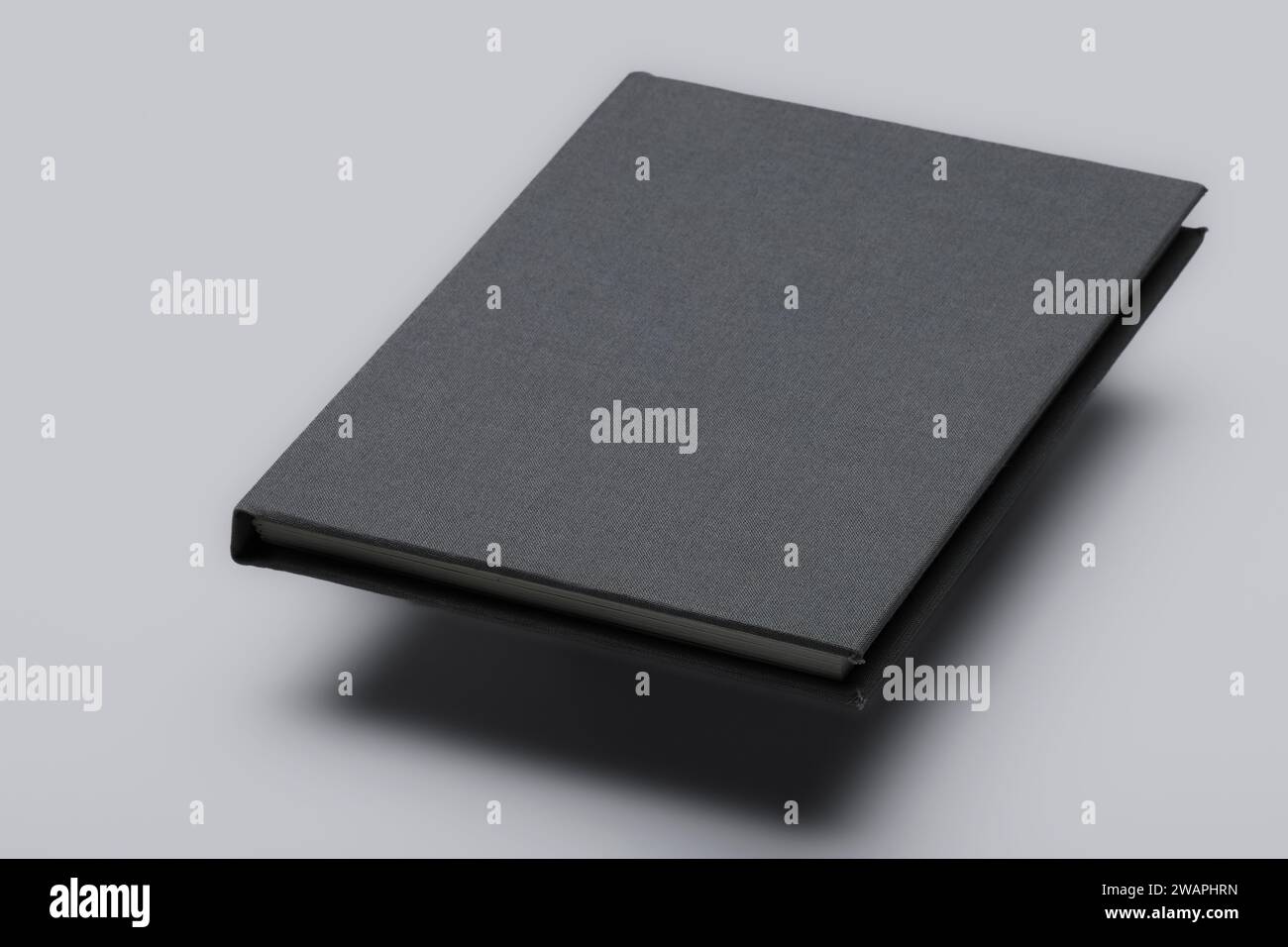 Empty grey floating book mockup. Studio shot of a blank closed book ...