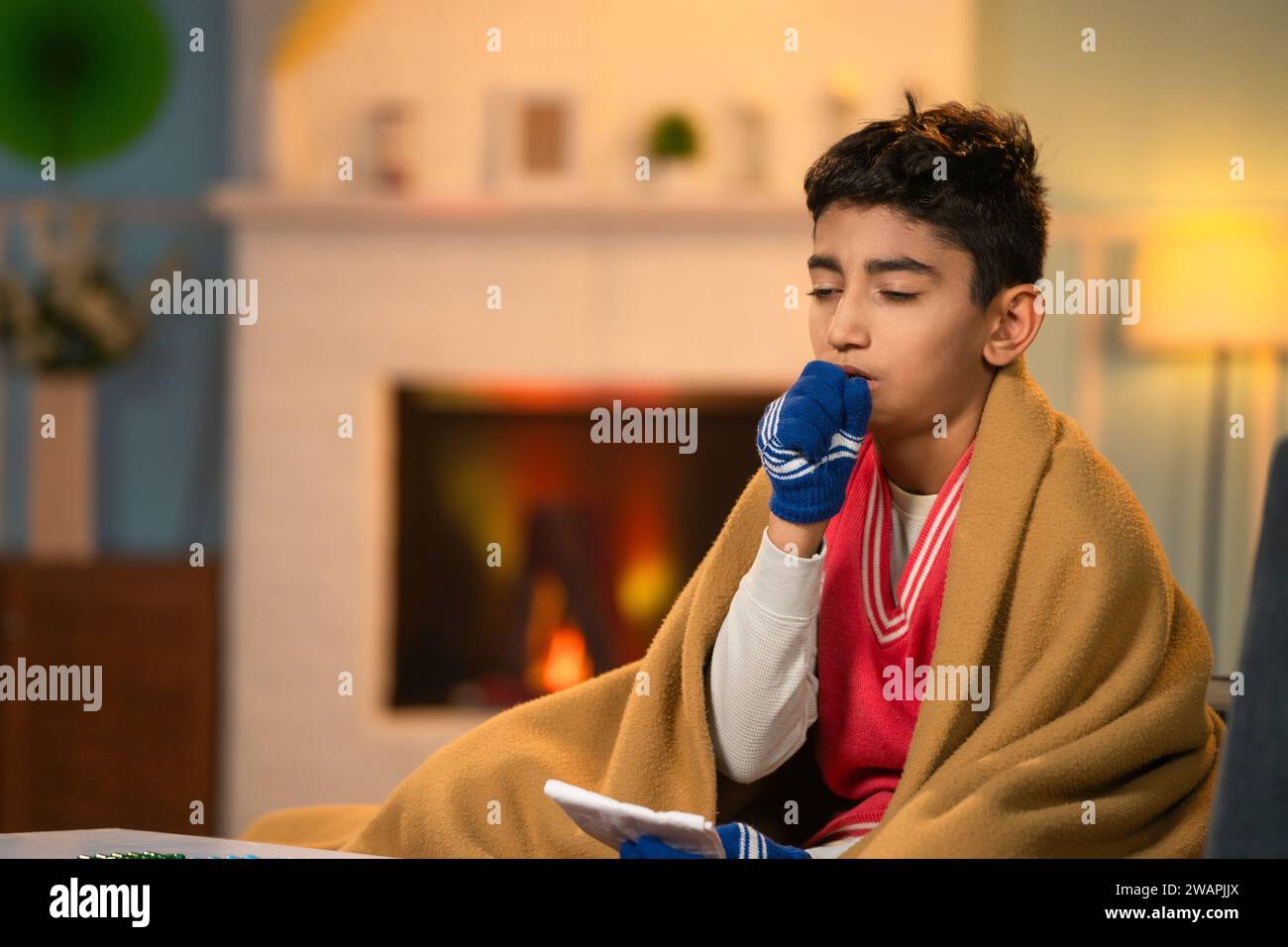 Young teenager sick kid suffering from cough and fever during winter ...