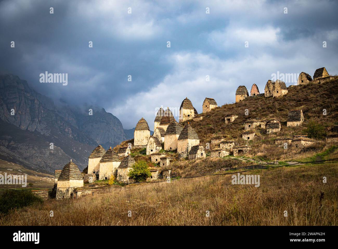 Amazing ruins of an ancient settlement among majestic mountain peaks ...
