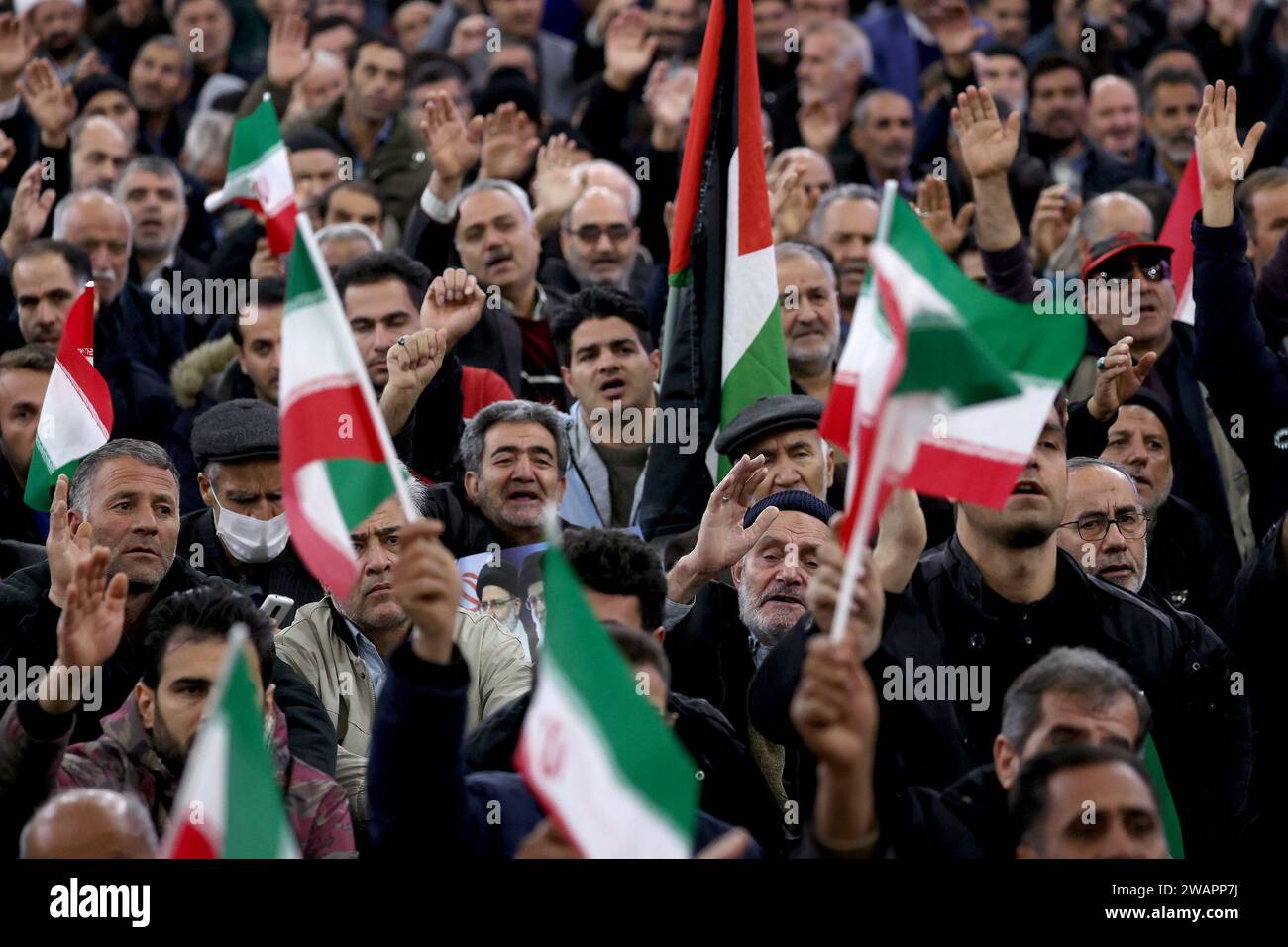 Zanjan, Iran. 6th Jan, 2024. Iranian males wave Iranian flags during ...