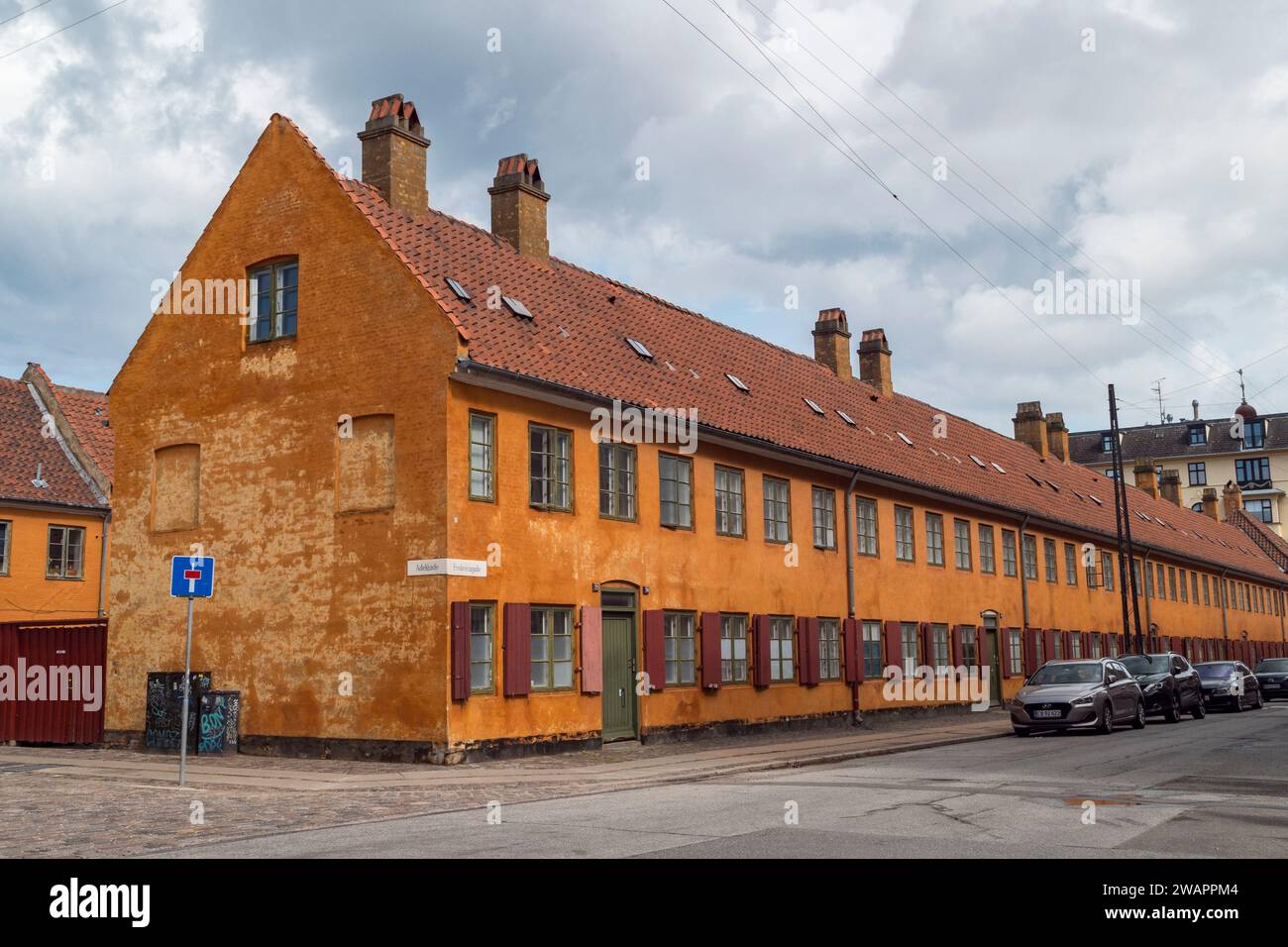 Classic yellow cottages in the historic row house district Nyboder ...