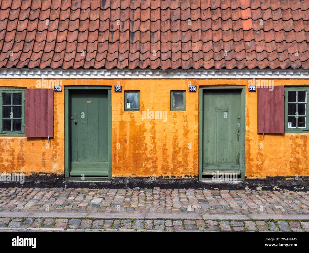 Front door details of two classic yellow cottages in the historic row ...