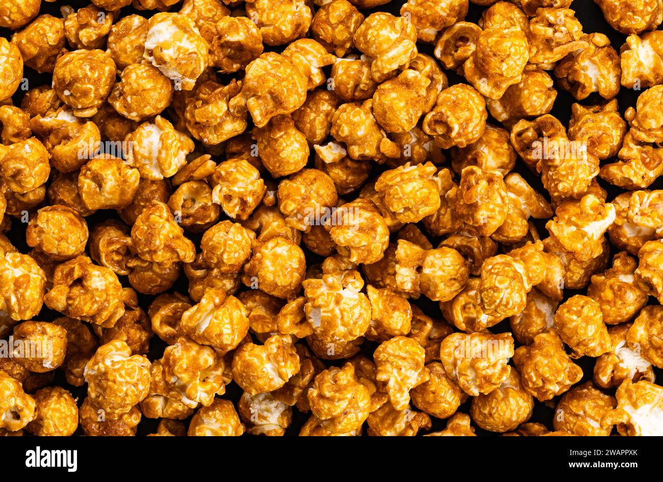 Top view pile of sweet caramel almonds use as background in horizontal ...