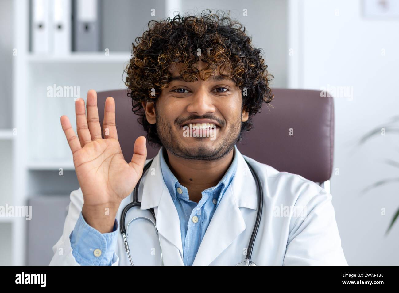 Webcam view, online video call consultation, young Indian doctor in ...