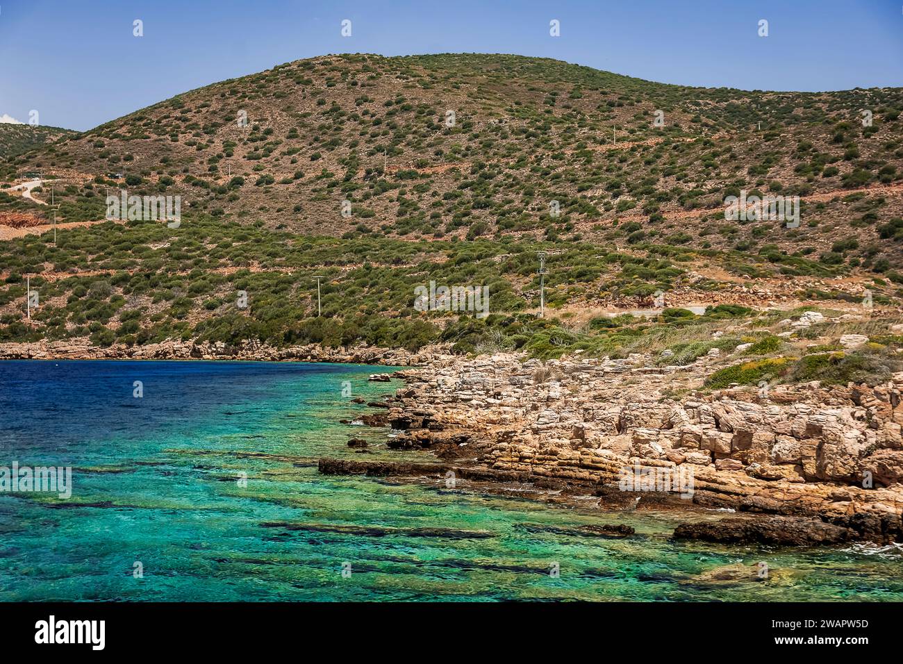 the turquoise sea of the pristine coves on the coast of Bodrum, a ...