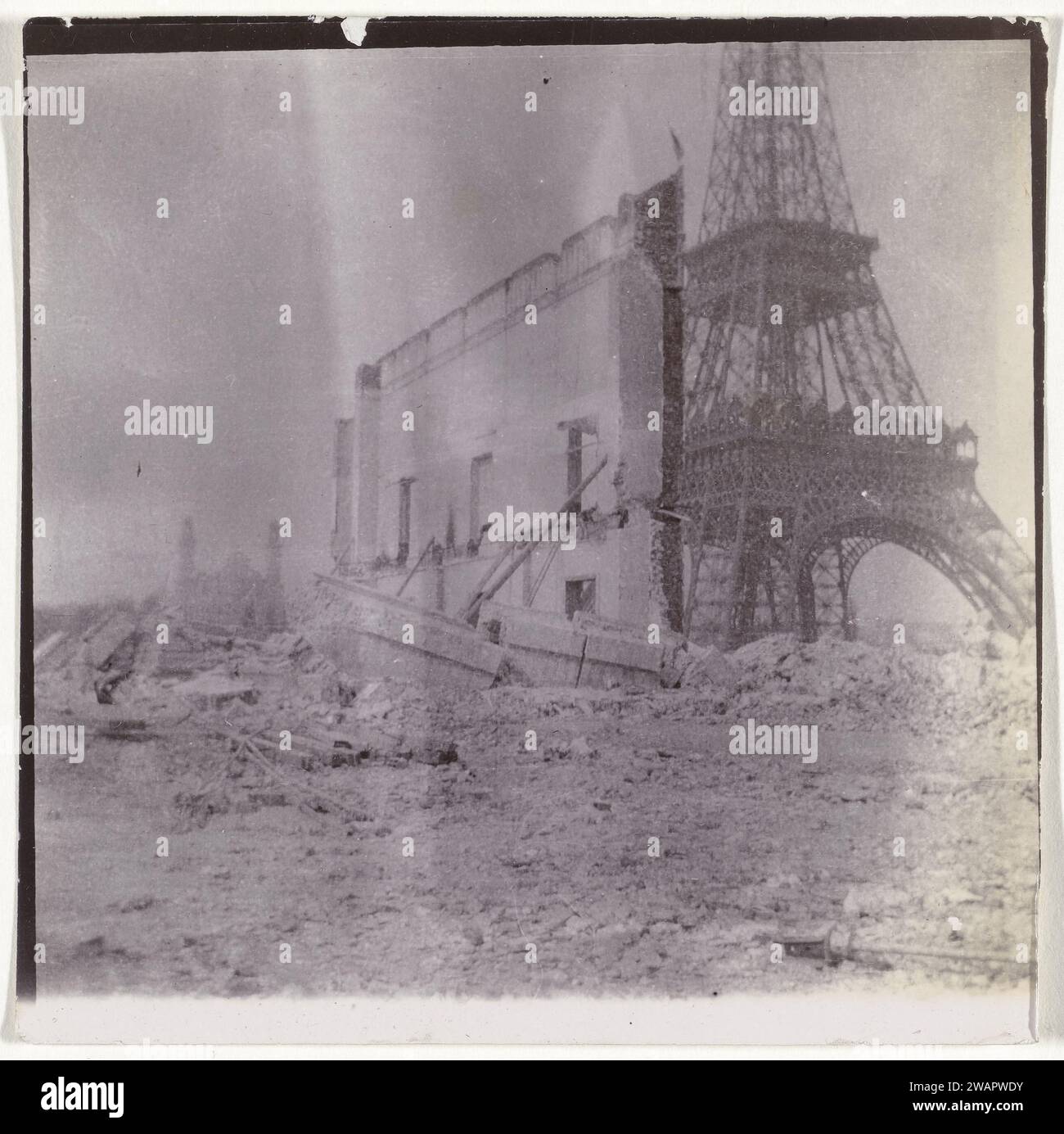 Construction of pavilions next to the Eiffel Tower for the World ...