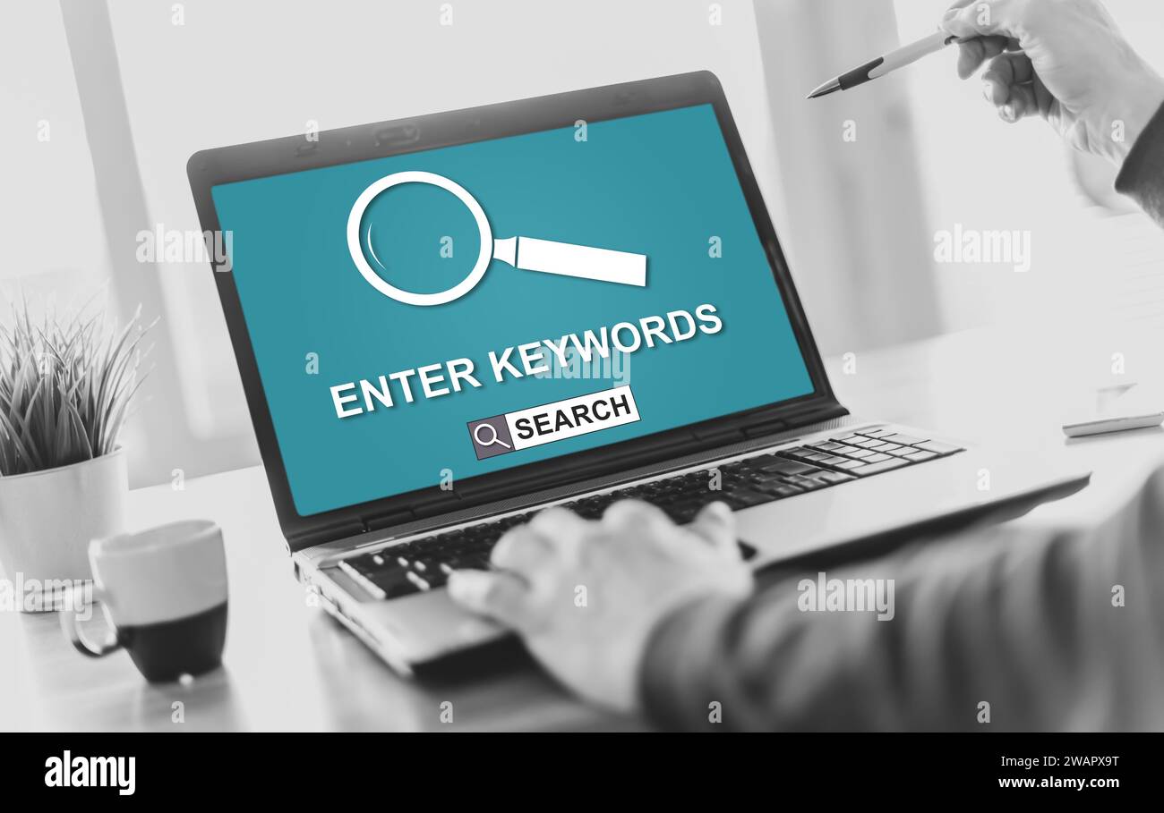 Laptop screen displaying a keywords search concept Stock Photo - Alamy