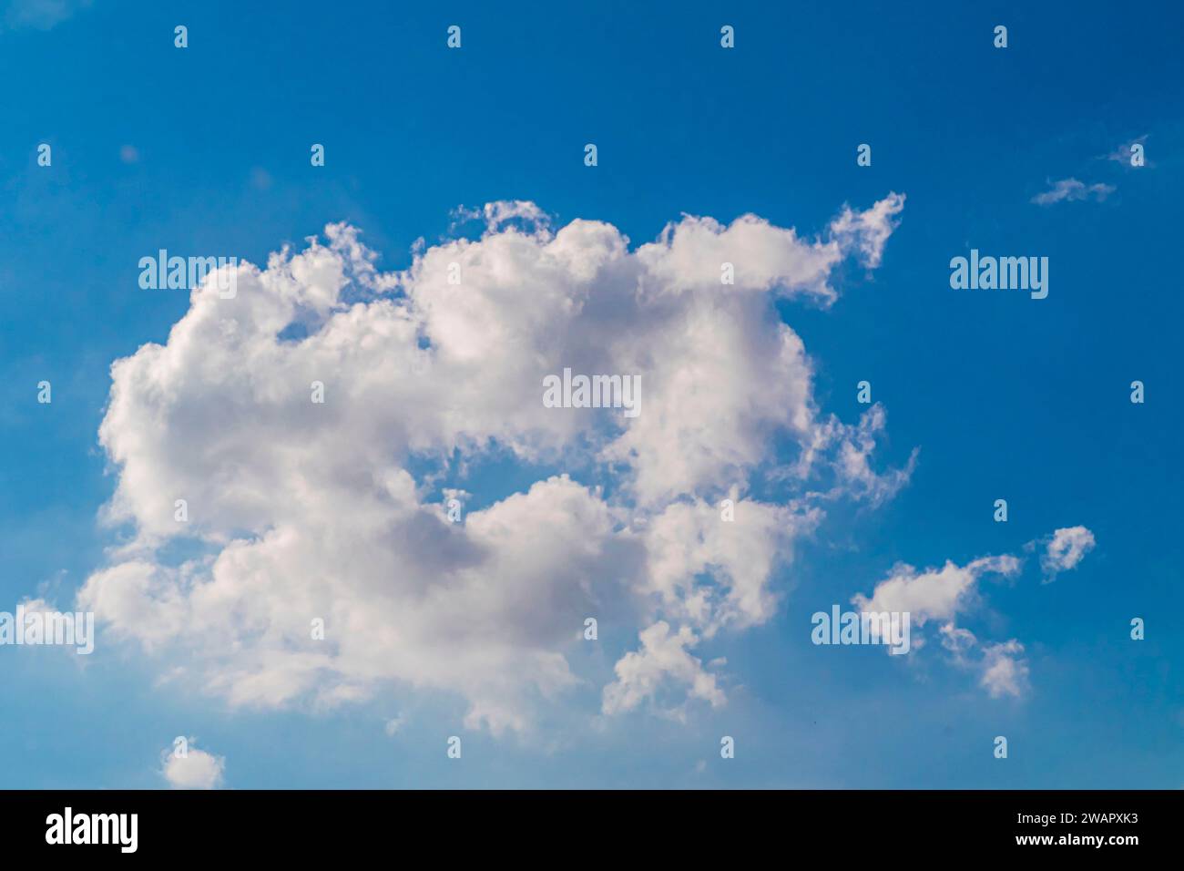Infinite Skies: Boundless Blue and Floating Clouds Stock Photo - Alamy