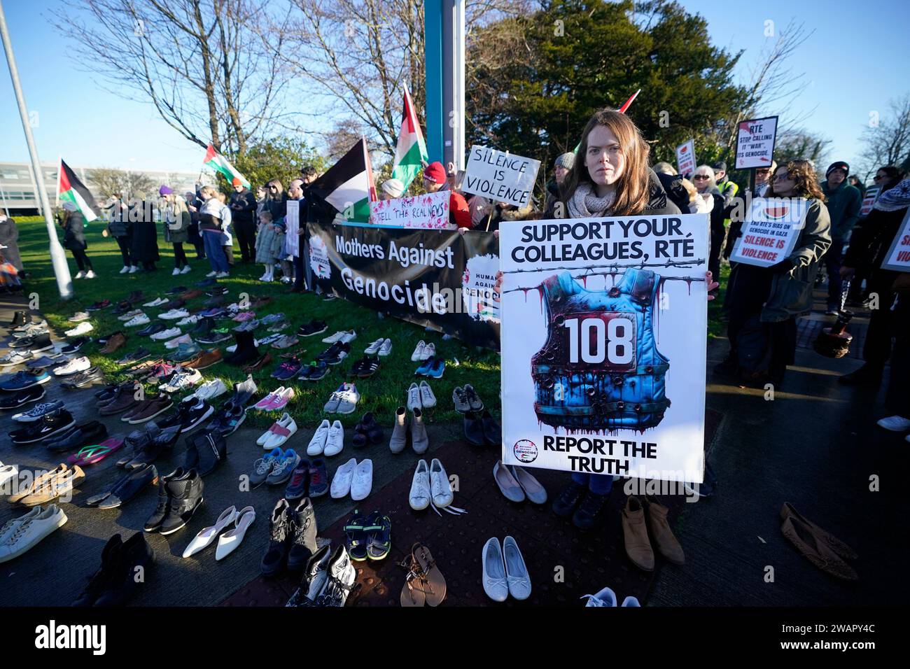 108 pairs of shoes for each journalist killed in Gaza are laid out as ...