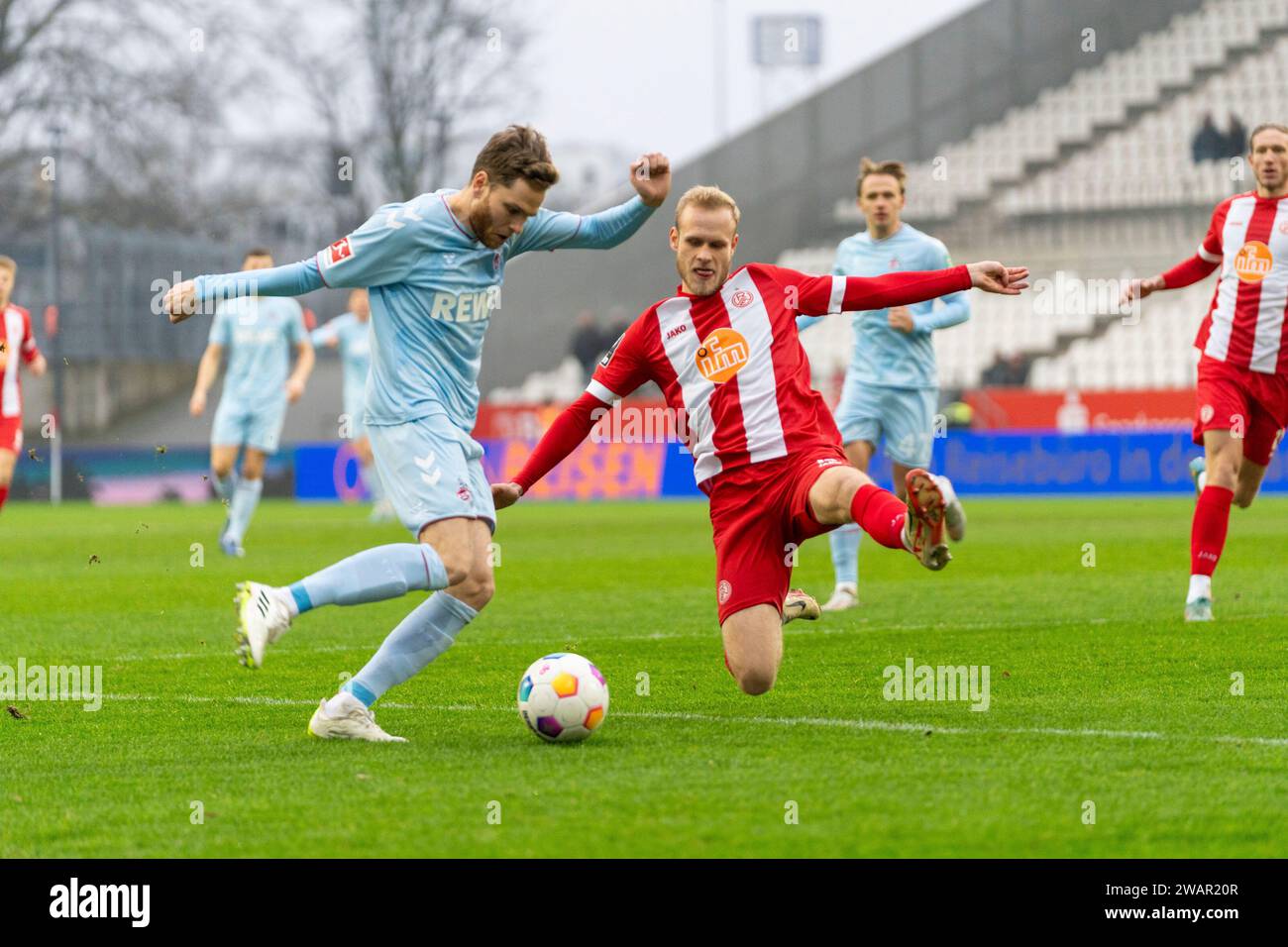 Essen, Deutschland. 14th Jan, 2023. Benno Schmitz (1. FC Koeln, #02), Lucas Brumme (RW Essen ...