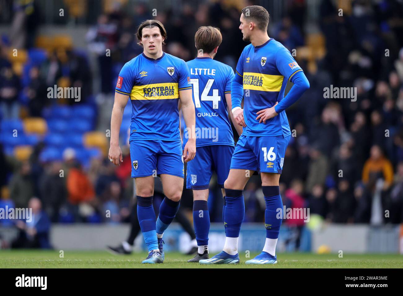 Wimbledon's Josh Davison (left) and James Ball react after the Emirates ...