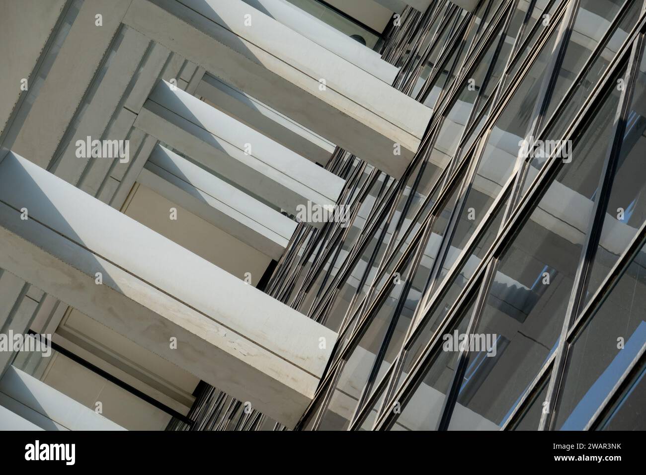 Diagonal view of a modern high-rise with intersecting lines and ...