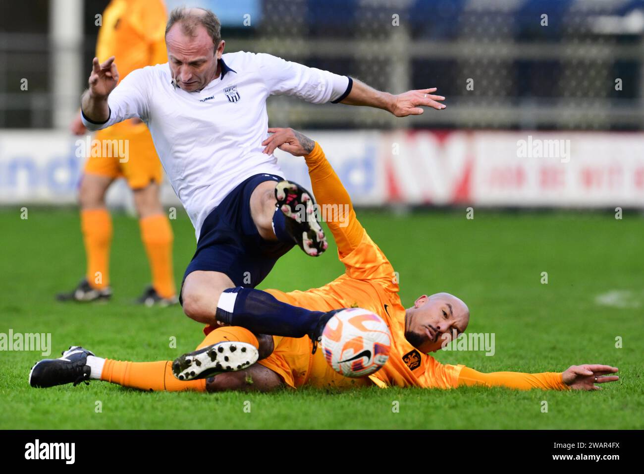 HAARLEM - Pascal Kamp of HFC is the victim of a hard tackle by former international Nigel de ...