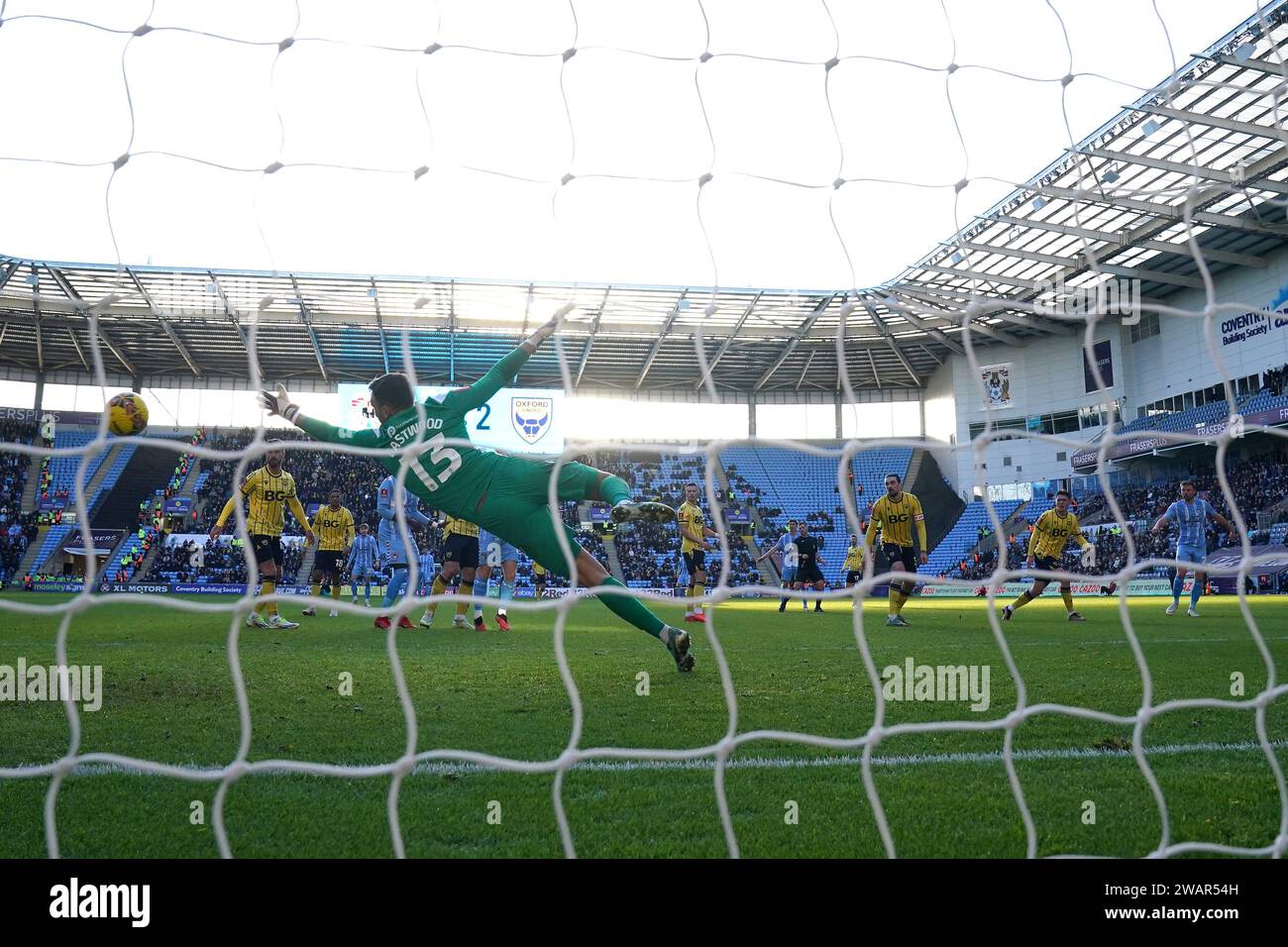 Coventry City's Matthew Godden (right) scores their side's fifth goal ...