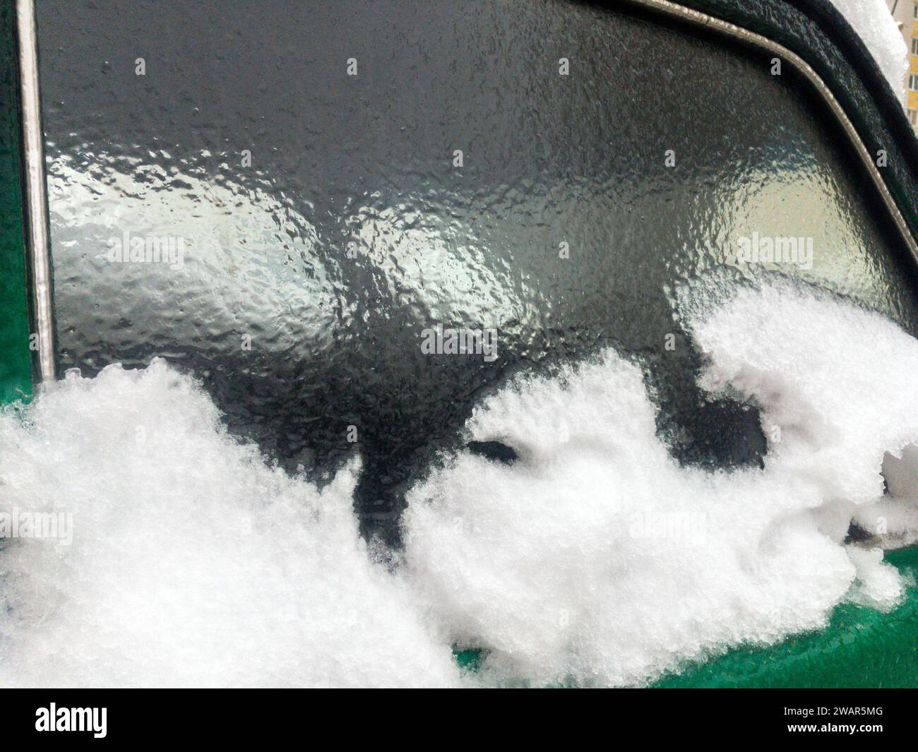 The side window of the car is covered with ice crust Stock Photo - Alamy