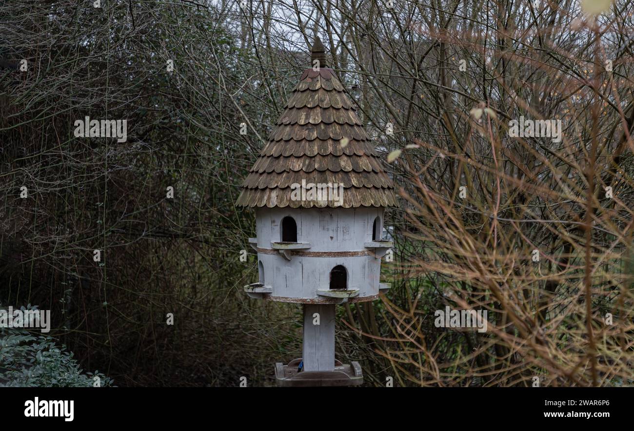 A dovecote shelter for birds and doves pigeons with multiple entrances ...