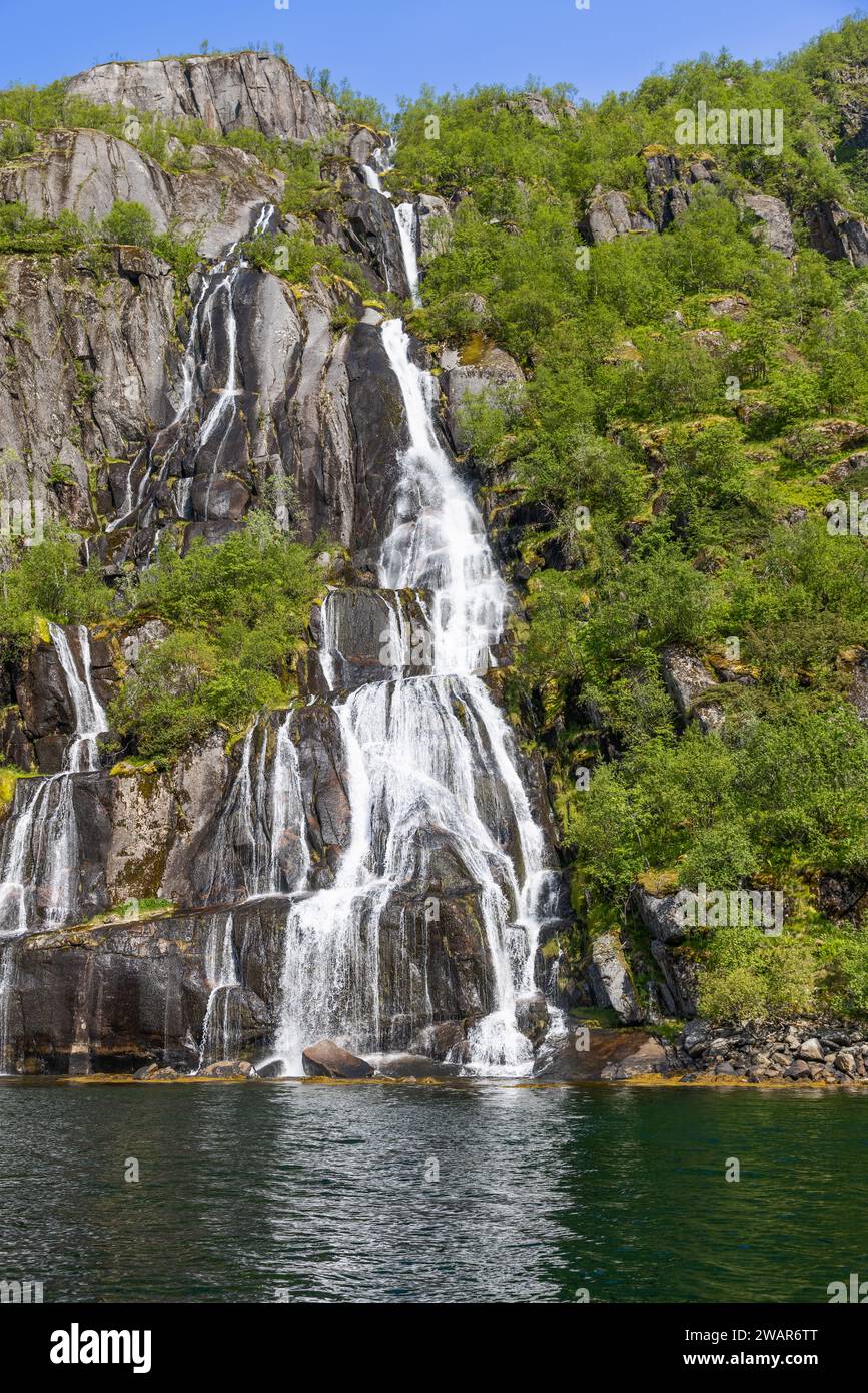 A vertical perspective of a cascading waterfall in Trollfjorden ...