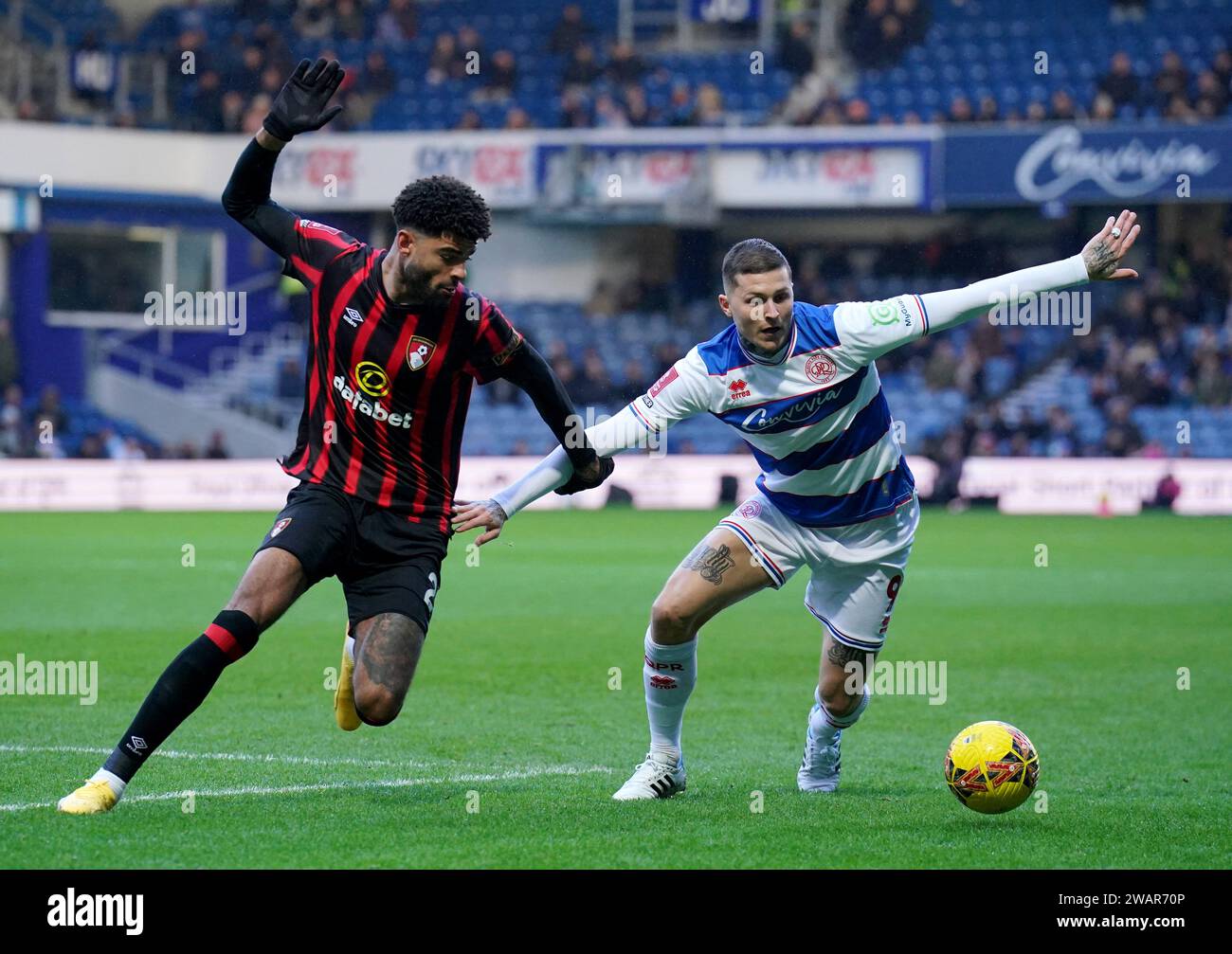 Bournemouth's Philip Billing (left) and Queens Park Rangers' Lyndon ...