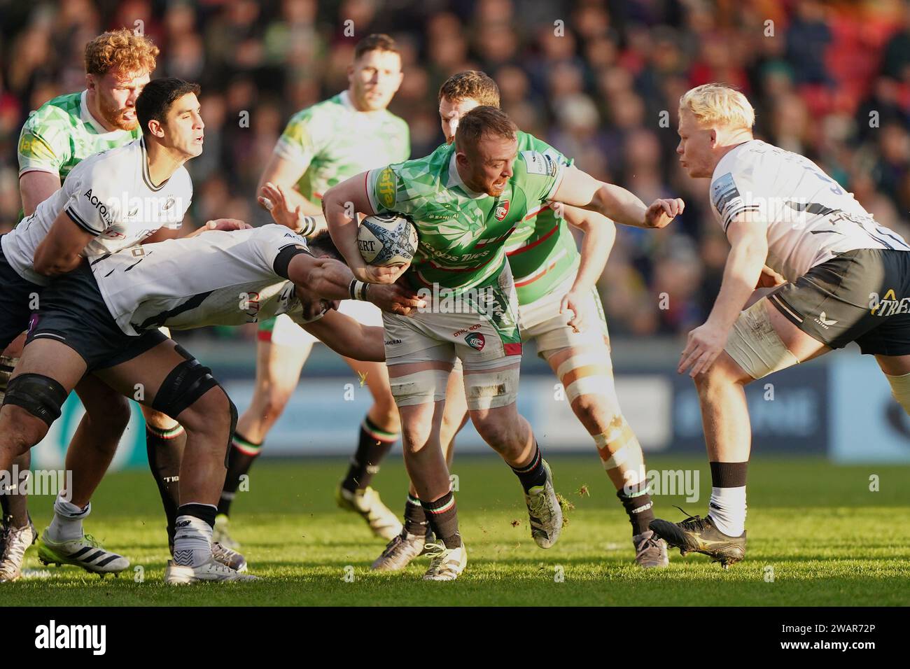 Leicester Tigers' Tommy Reffell (centre) is tackled by Saracens' Theo ...
