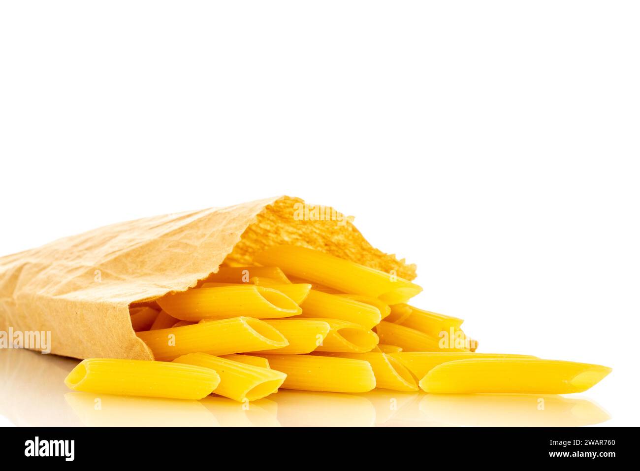 Uncooked pasta, penne, with paper bag, macro, isolated on white ...