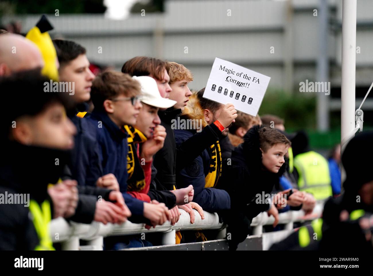 A fan holds up a sign in protest of the FA during the Emirates FA Cup ...